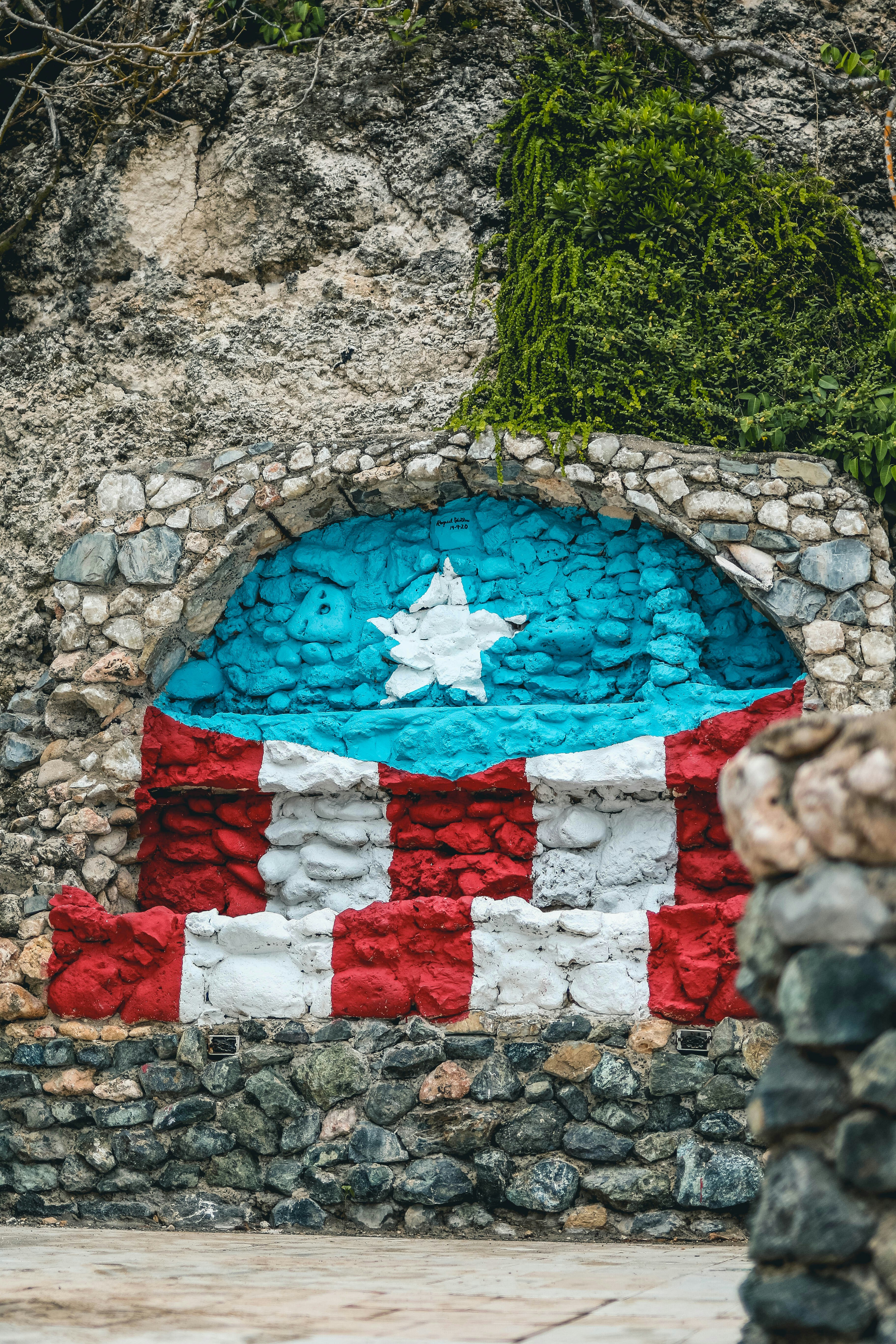 A flag painted on a stone wall photo – Free Puerto rico Image on Unsplash