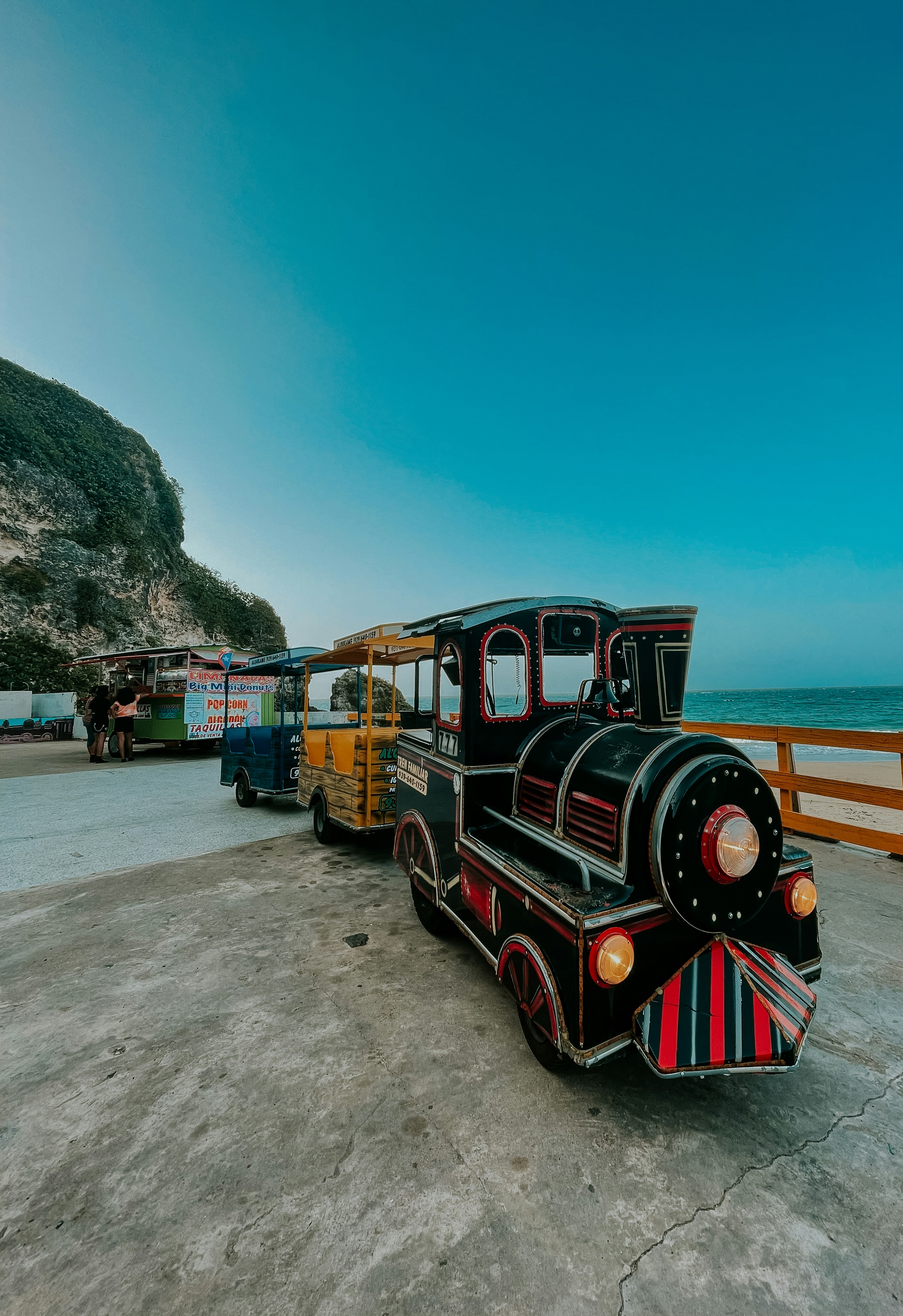 Coastal Steam on the Pier: A Vintage Train by the Sea