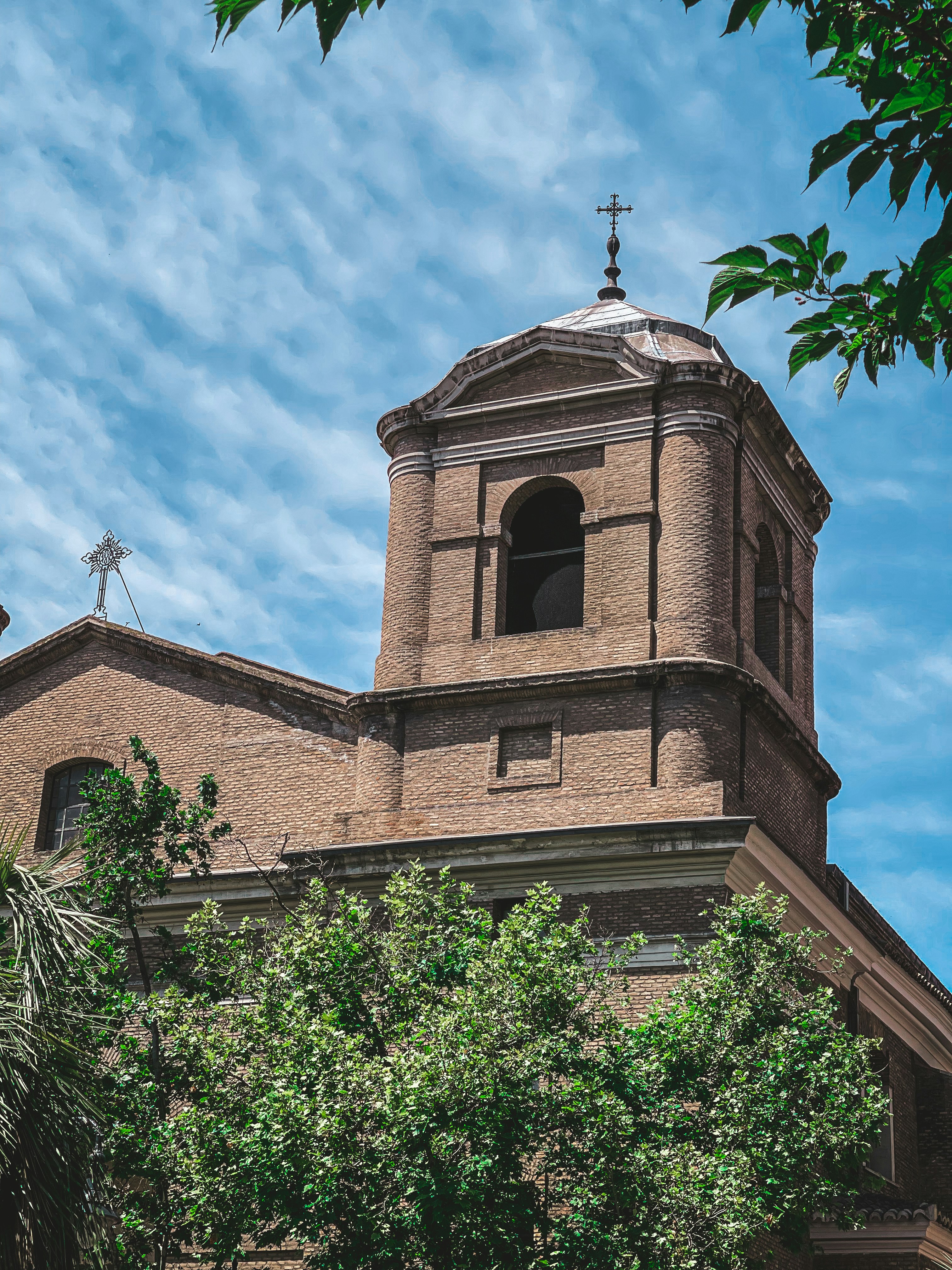 A brick building with a cross on top photo – Free Architecture Image on ...