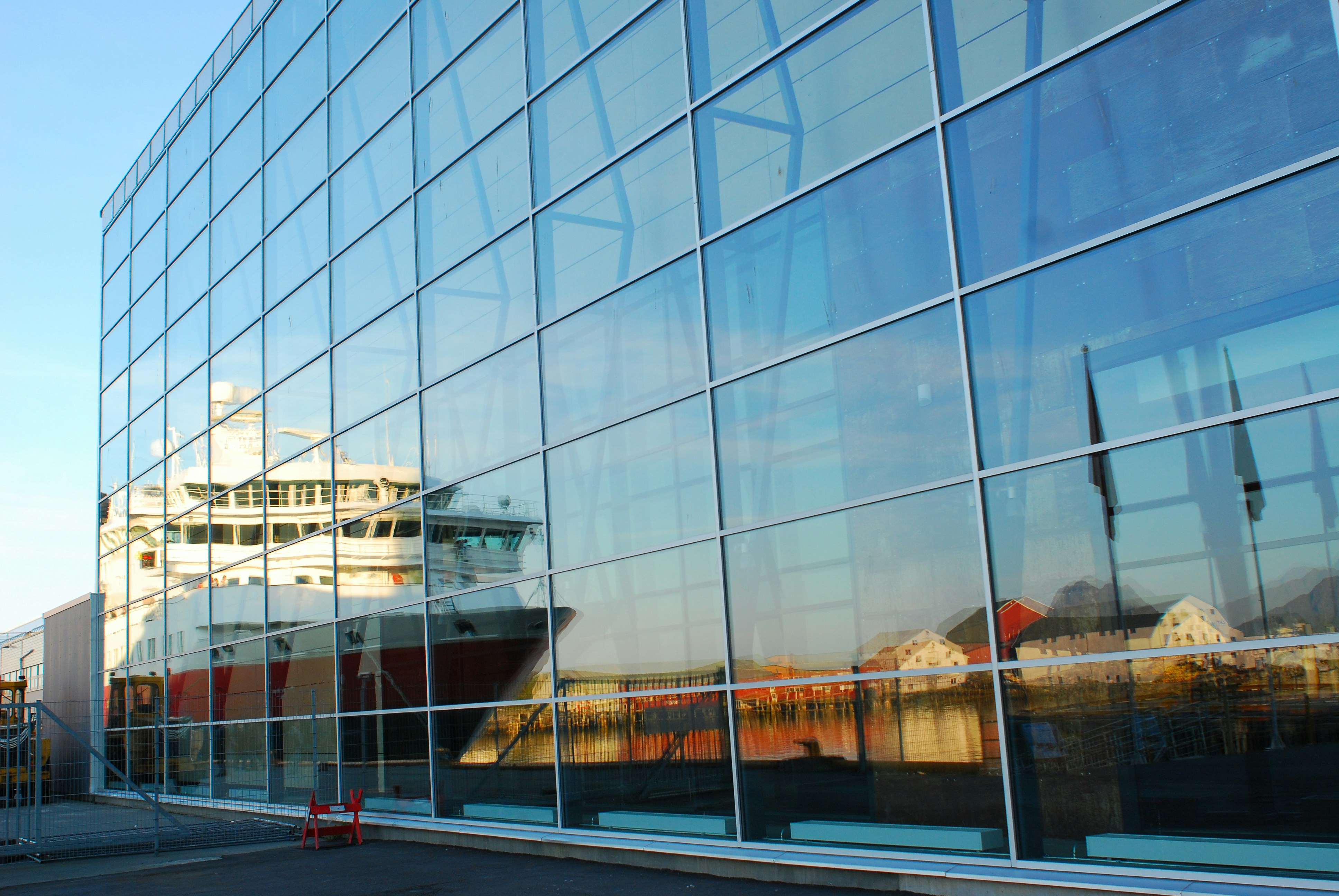Harbor Echo in a Glass Prism: Reflections on a Modern Facade