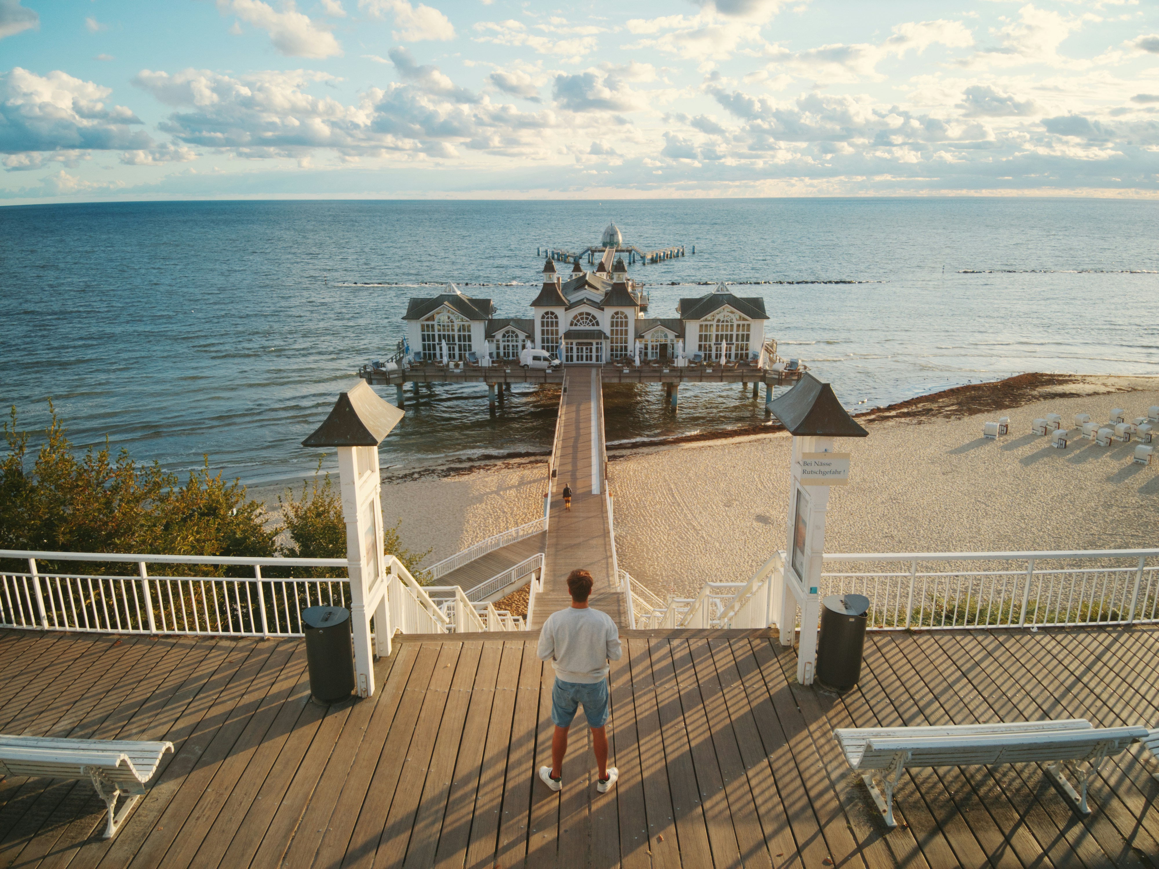 A person walking on a deck photo – Free Sellin Image on Unsplash