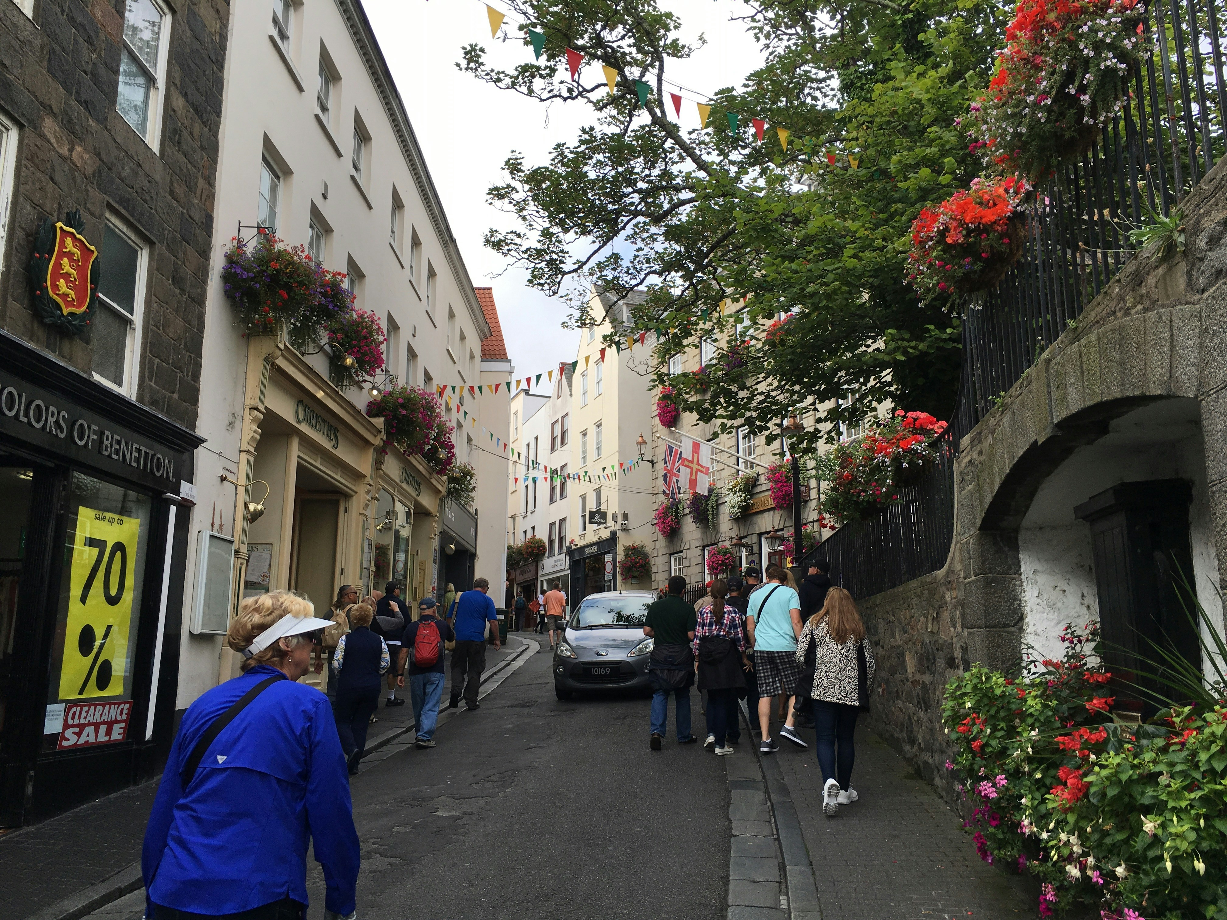Stone Bohemia: Pedestrians Ascend a Cobbled Market Street