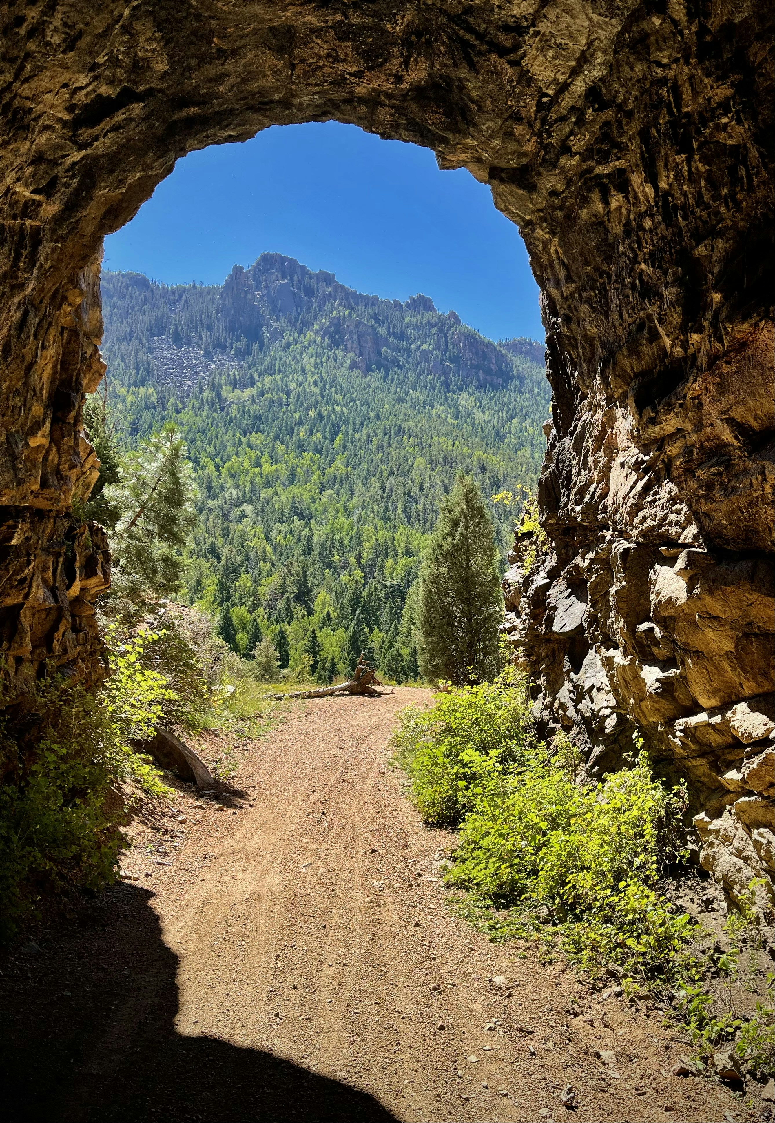 A dirt road through a cave photo – Free Gravel Image on Unsplash