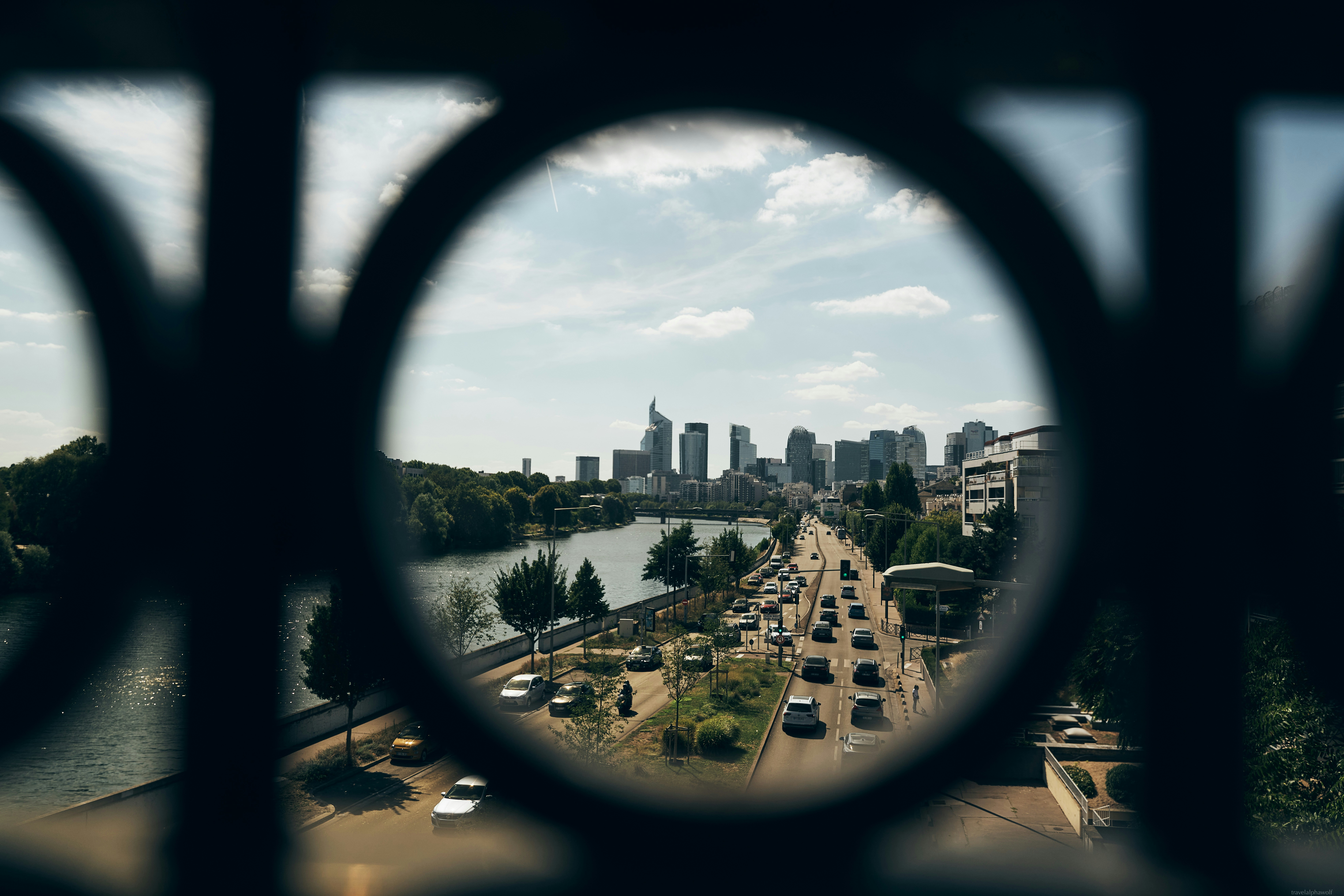 Circular Frames, City Pulse: A Riverfront Drive Toward the Skyline