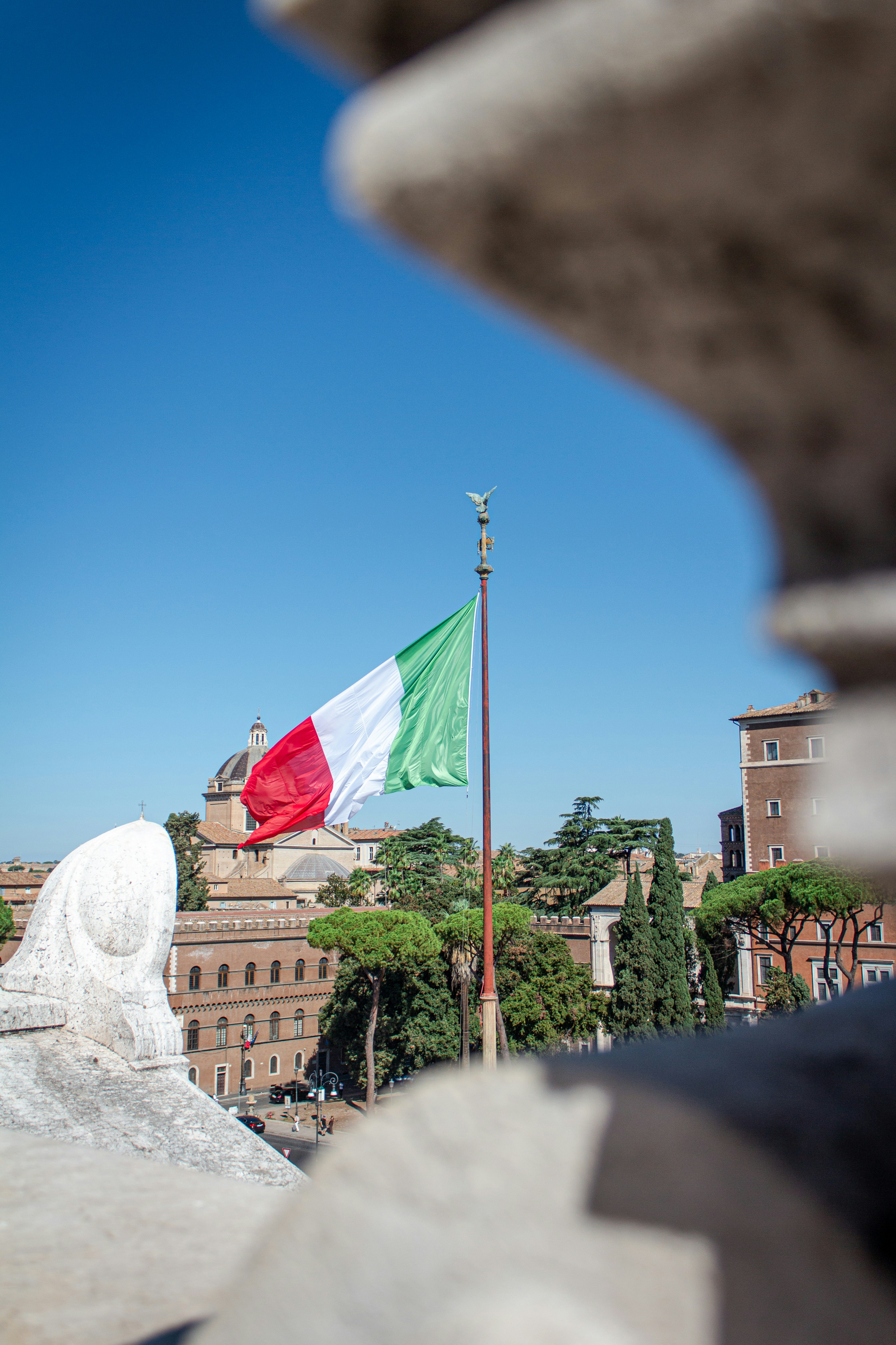 A flag on a pole photo – Free Rome Image on Unsplash