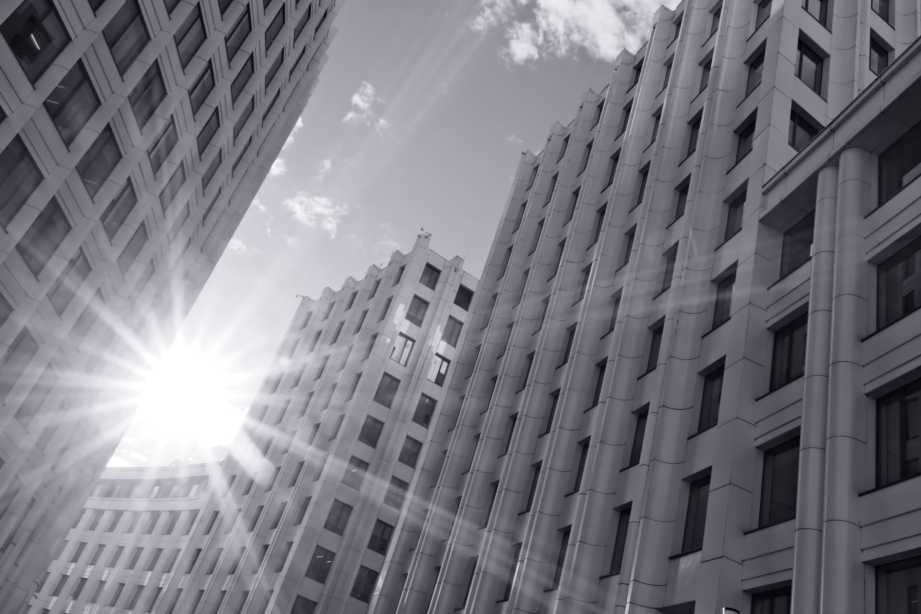 Sunburst Between Skyscrapers: A Monochrome Urban Portrait