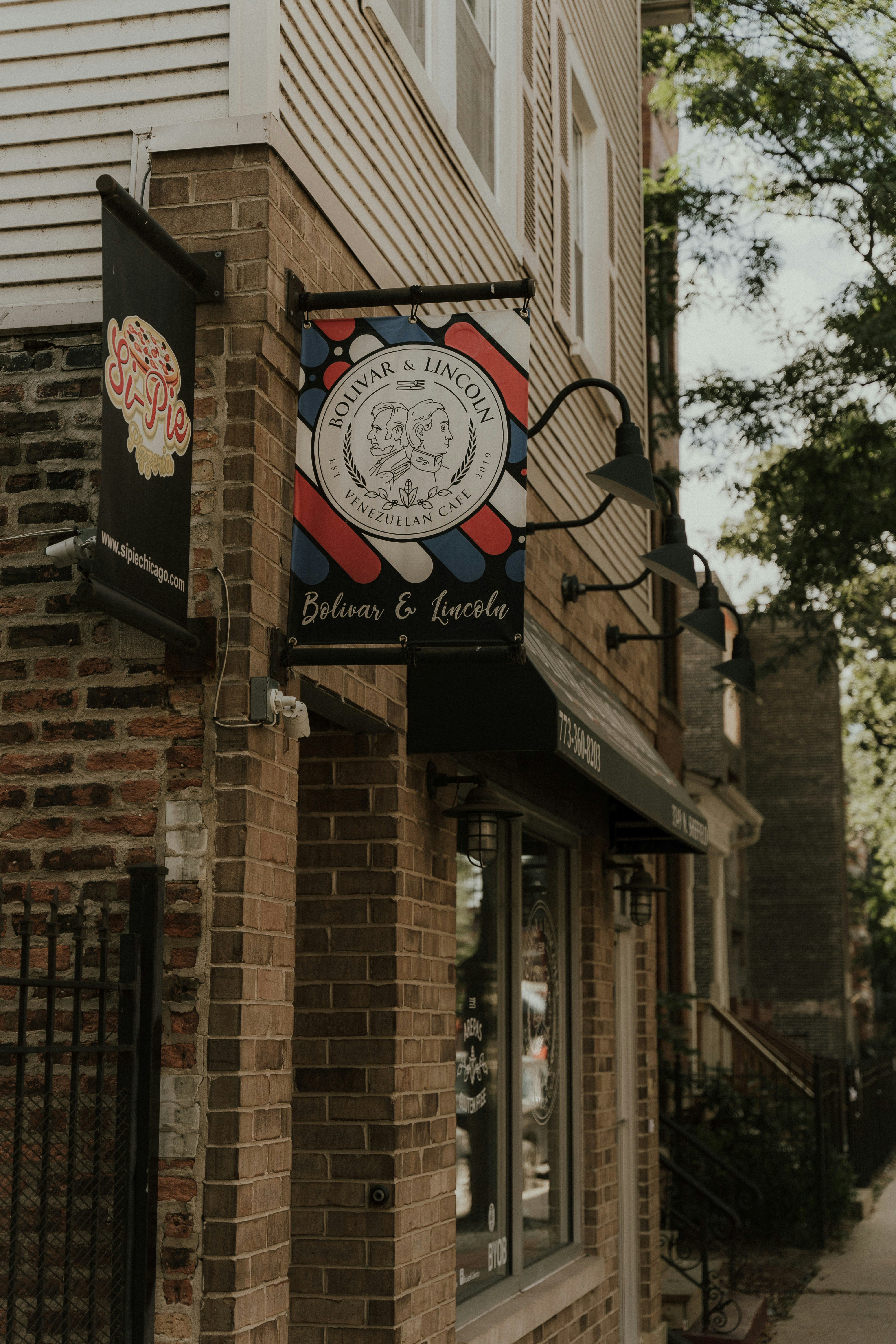 Brick-and-rail Signage on a Quiet City Street