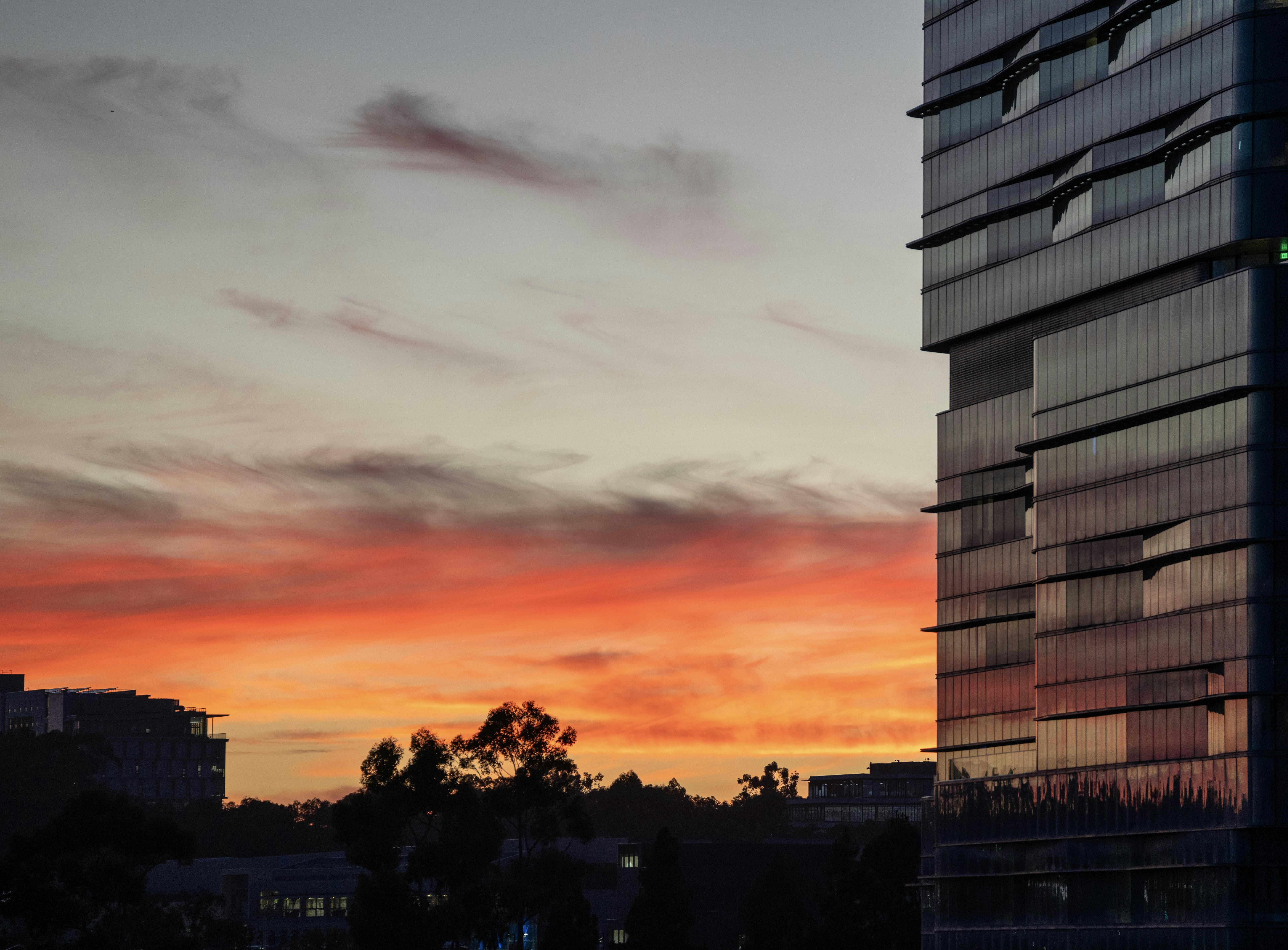 A building with a sunset in the background photo – Free Image on Unsplash