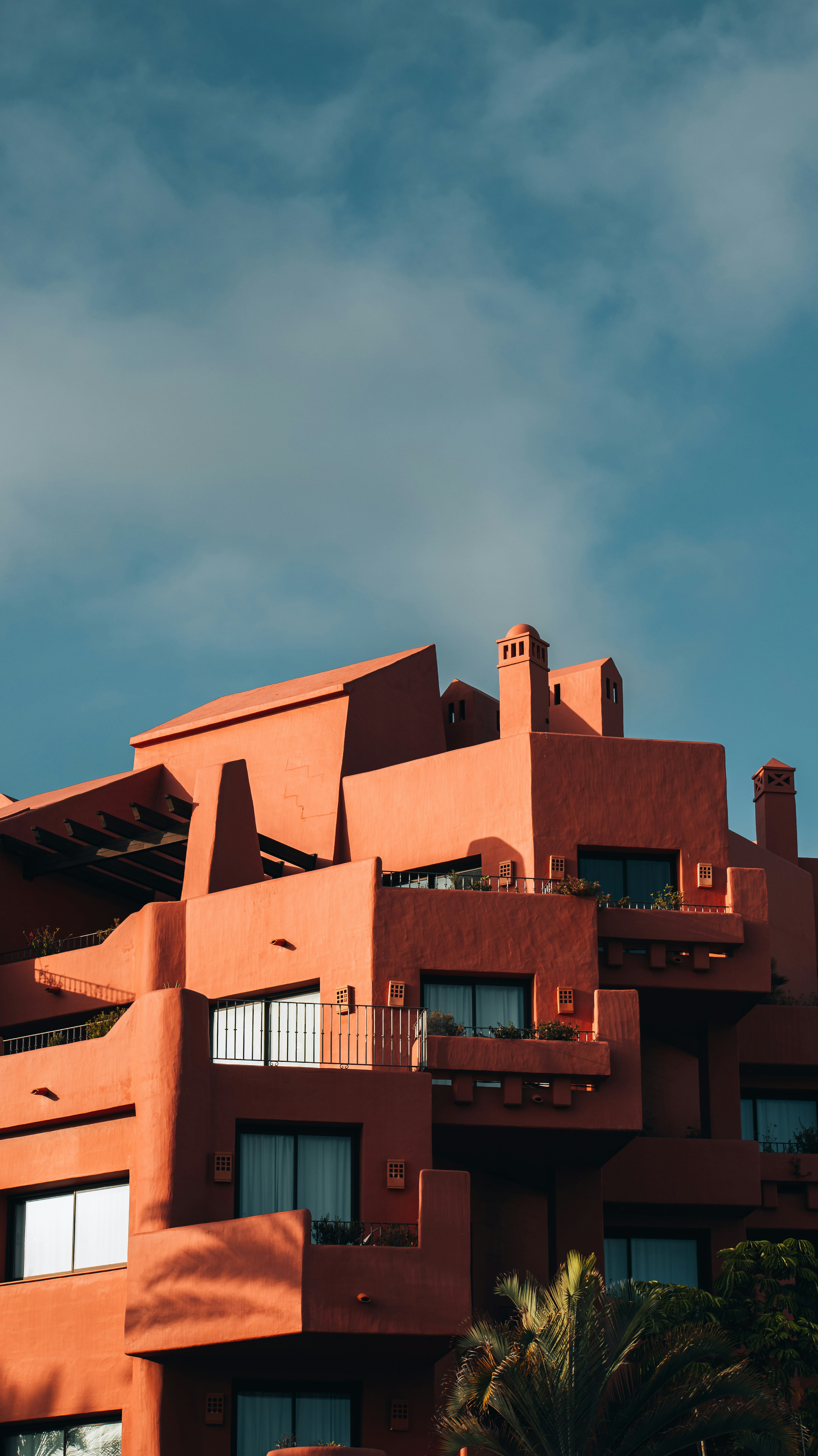 Terracotta Rhythm: Terraced Architecture Under a Cerulean Sky