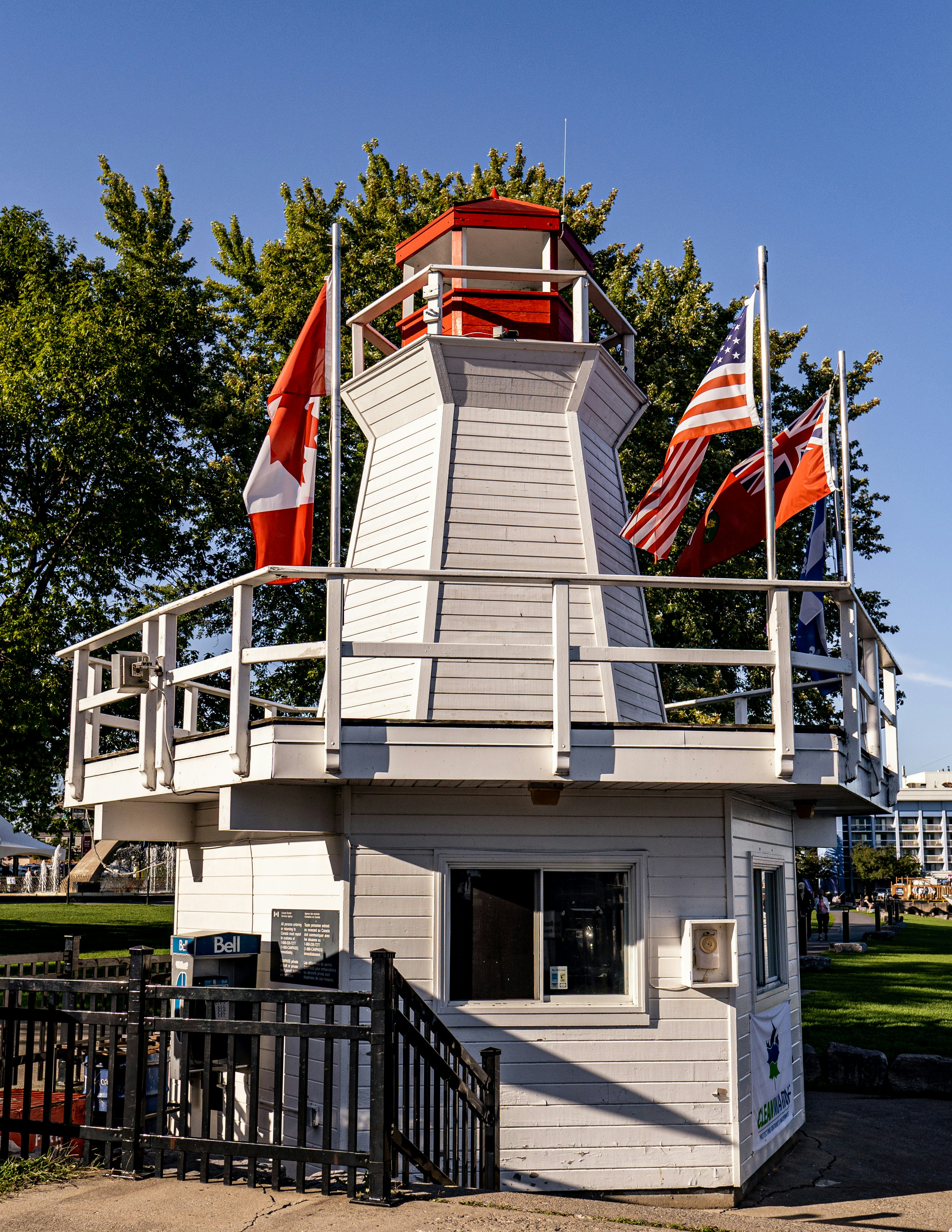 Flag-Fenced Watchtower on a Sunny Parkfront