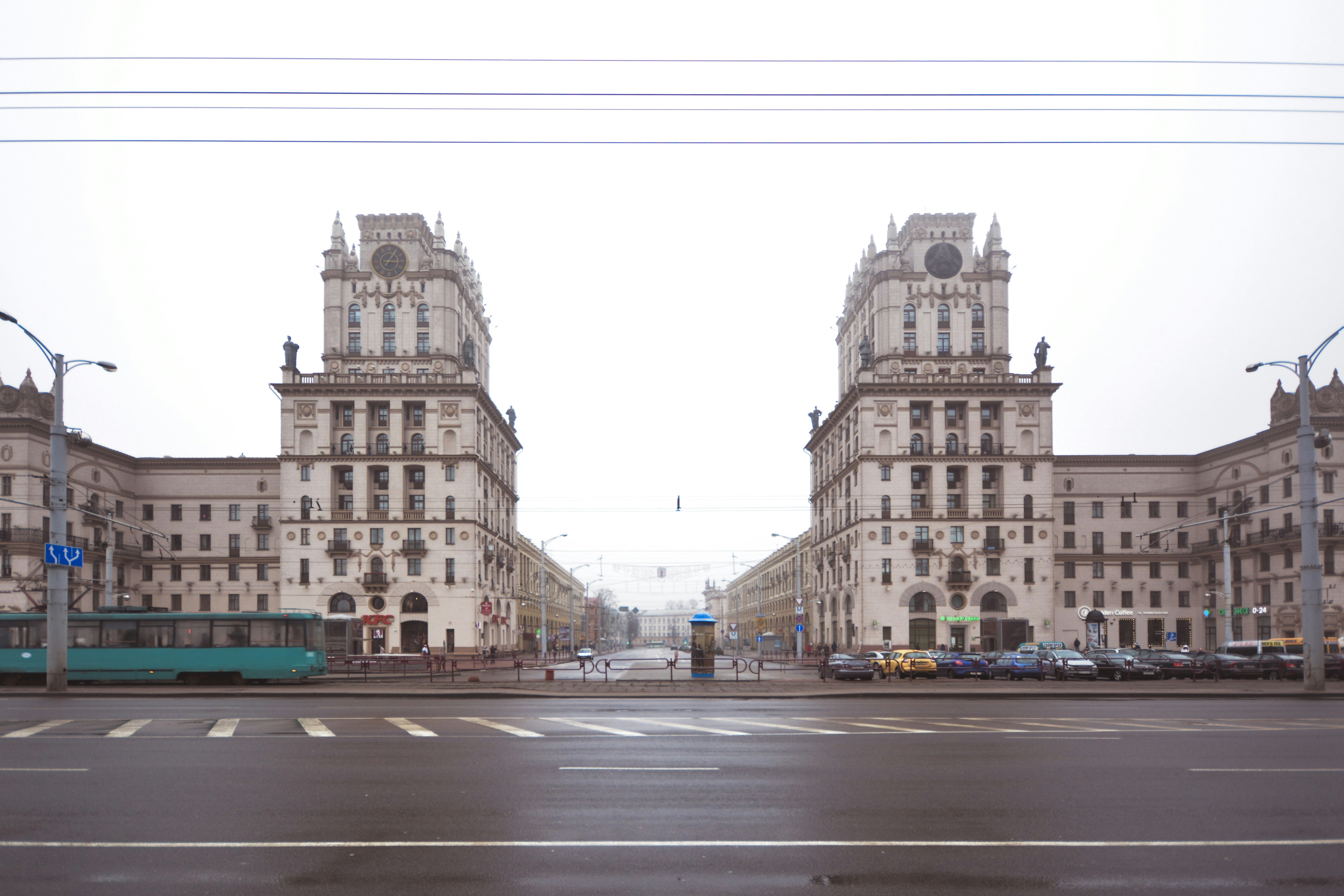 A street with buildings on either side with Leaning Tower of Pisa in ...