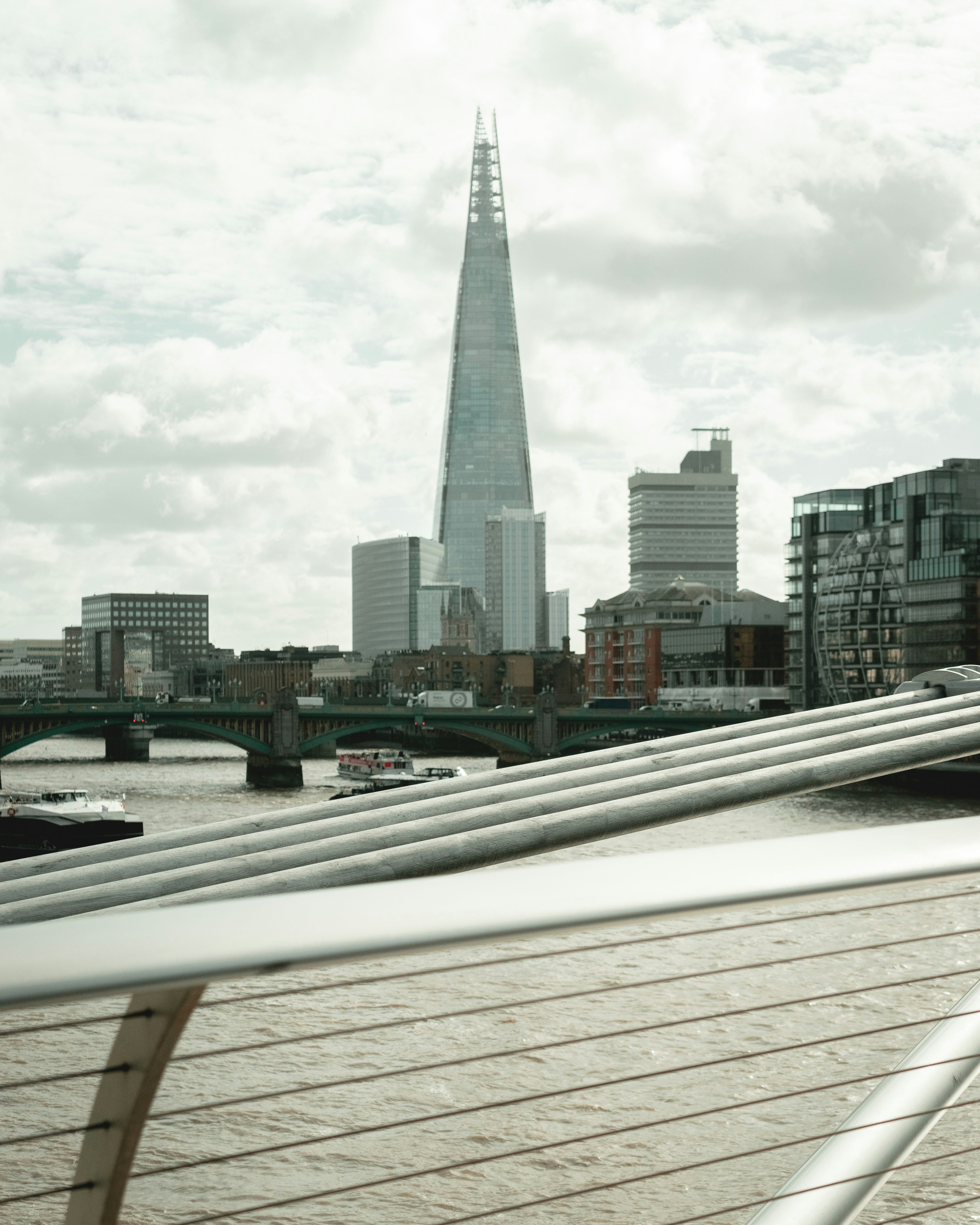 The Shard Rises Over the Thames: A Rail-Frame Cityscape