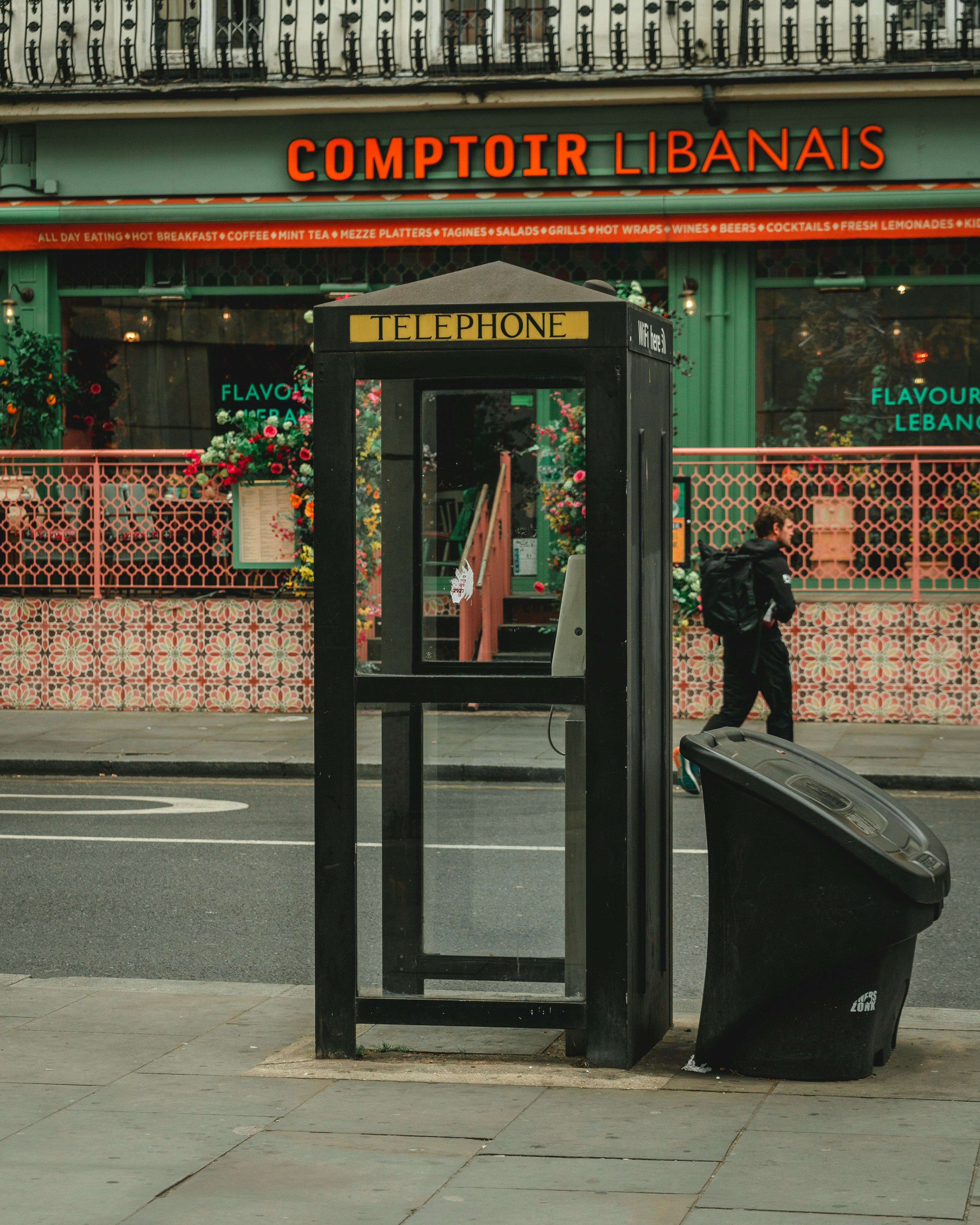 A person walking out of a store photo – Free London Image on Unsplash