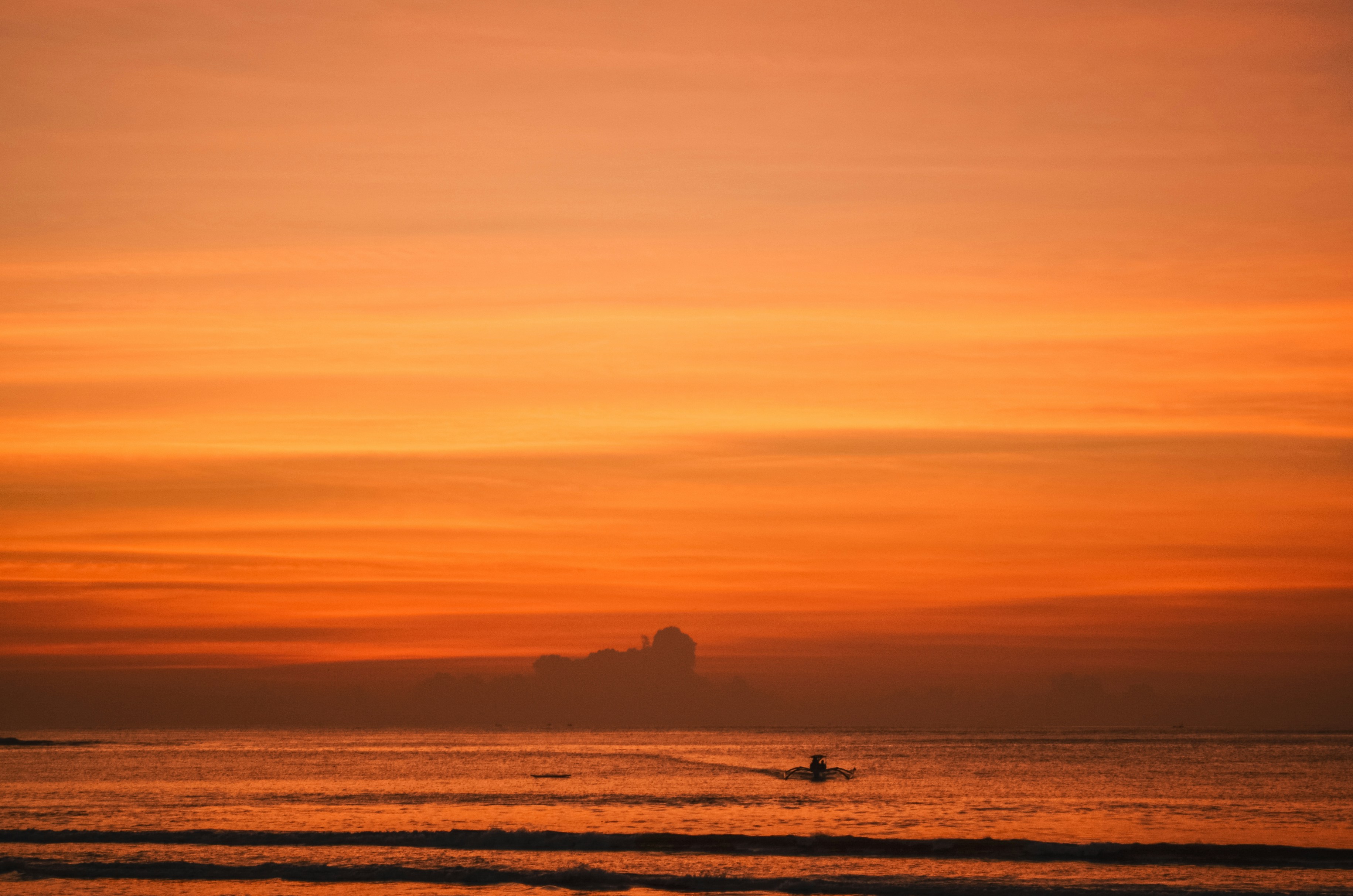 Ember Horizon: A Lone Vessel at Dusk