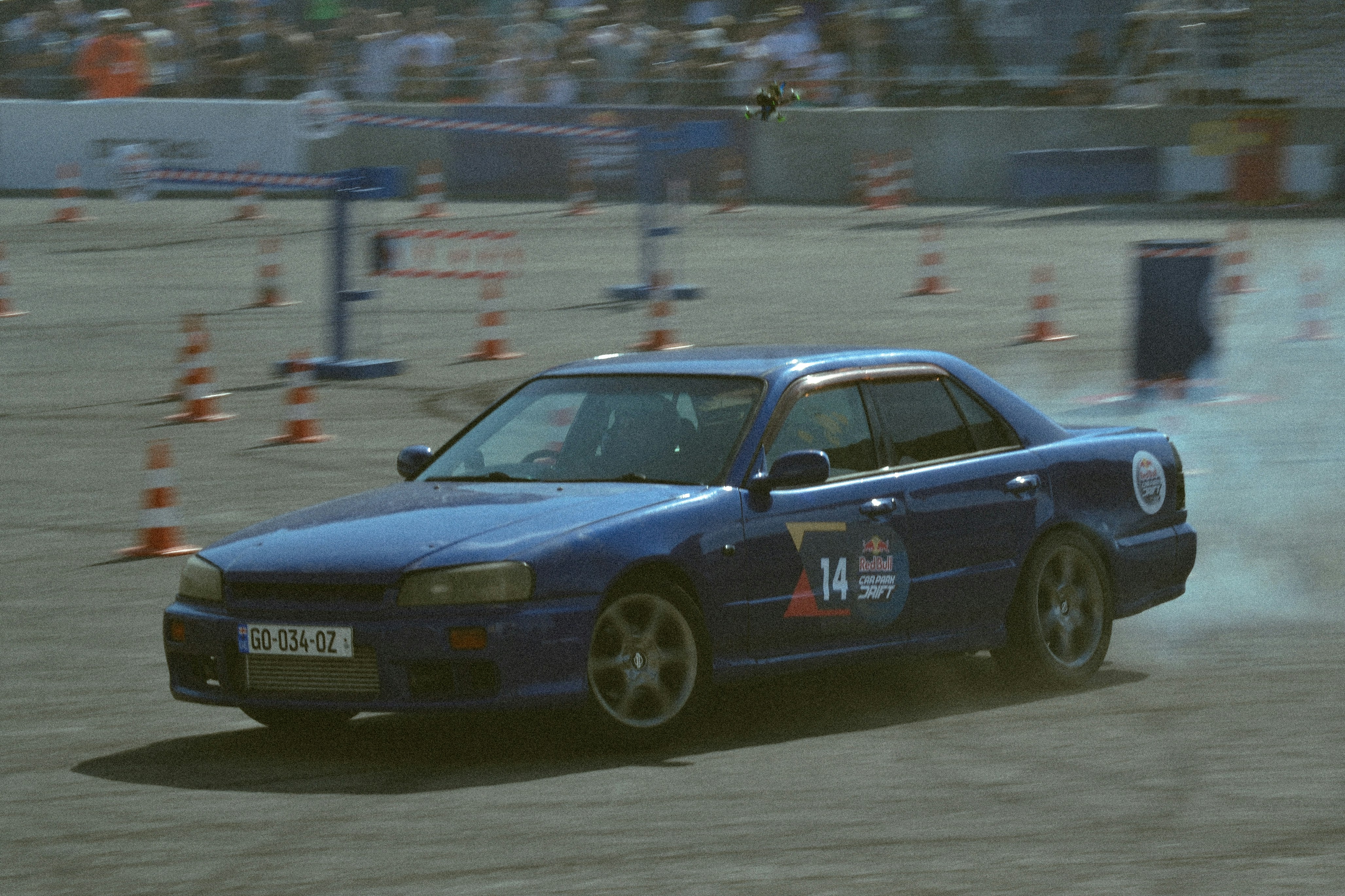 A blue car on a race track photo – Free Nissan skyline Image on Unsplash