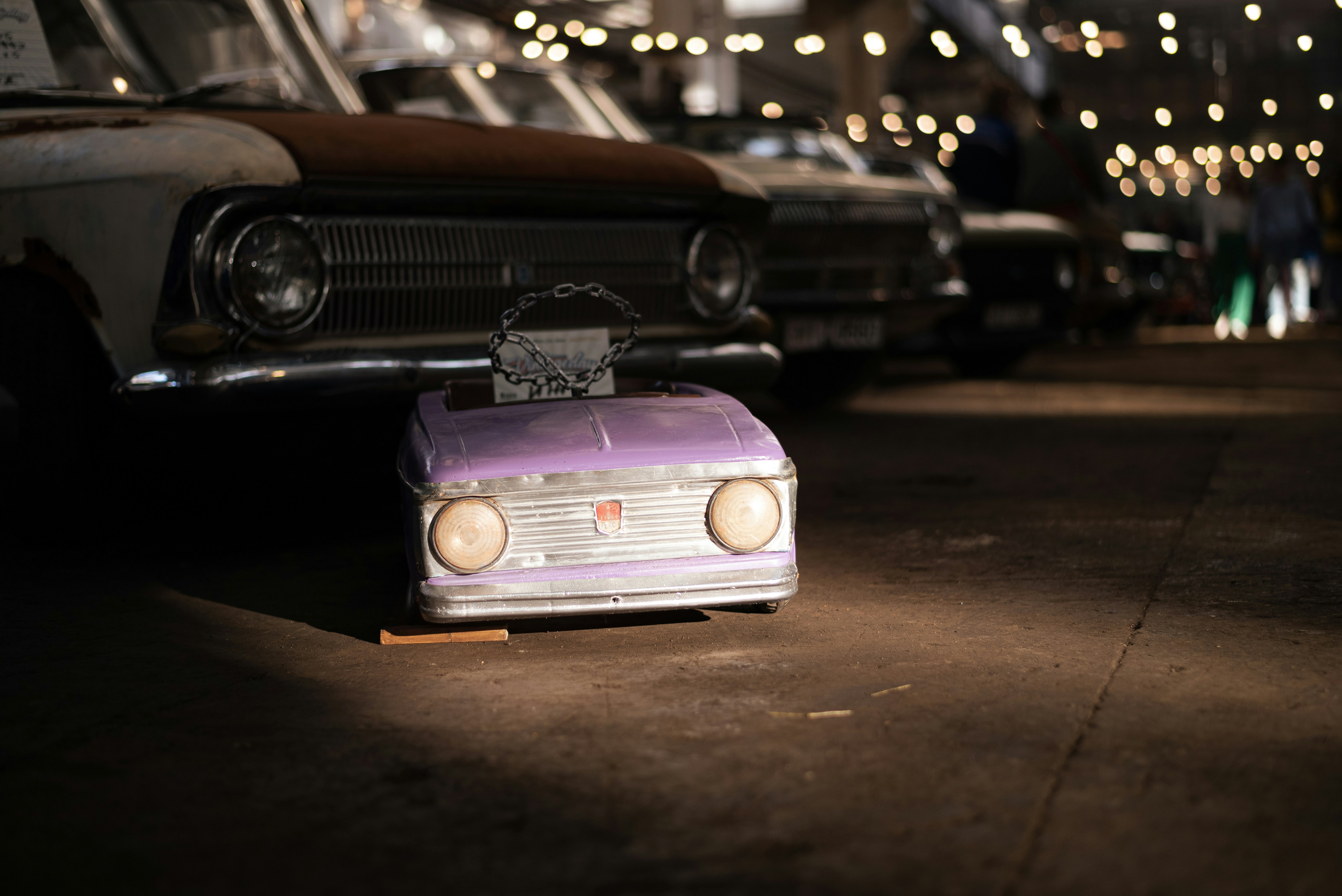 a row of cars parked in a parking lot