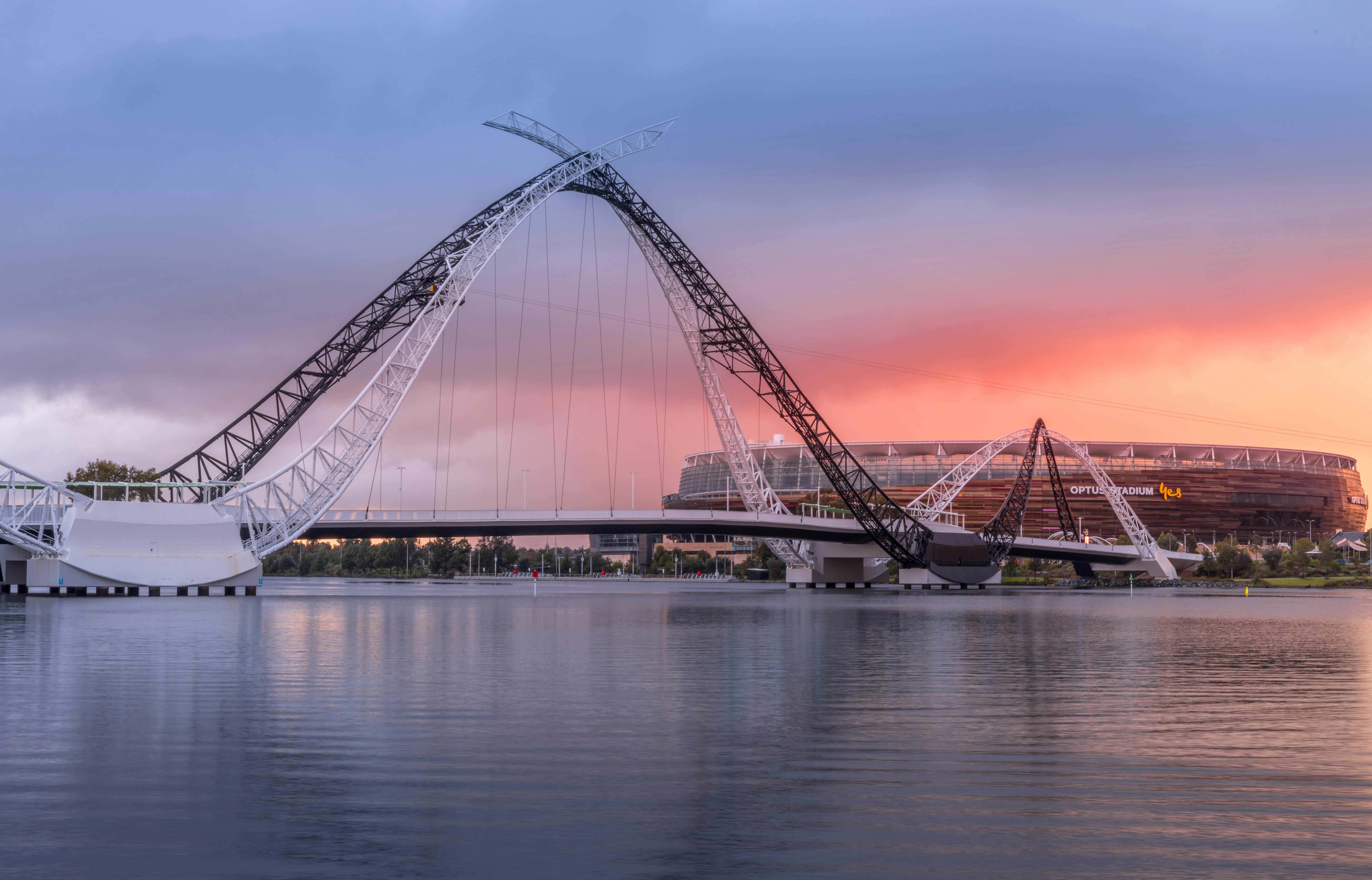 A roller coaster by a body of water photo – Free Matagarup bridge Image ...