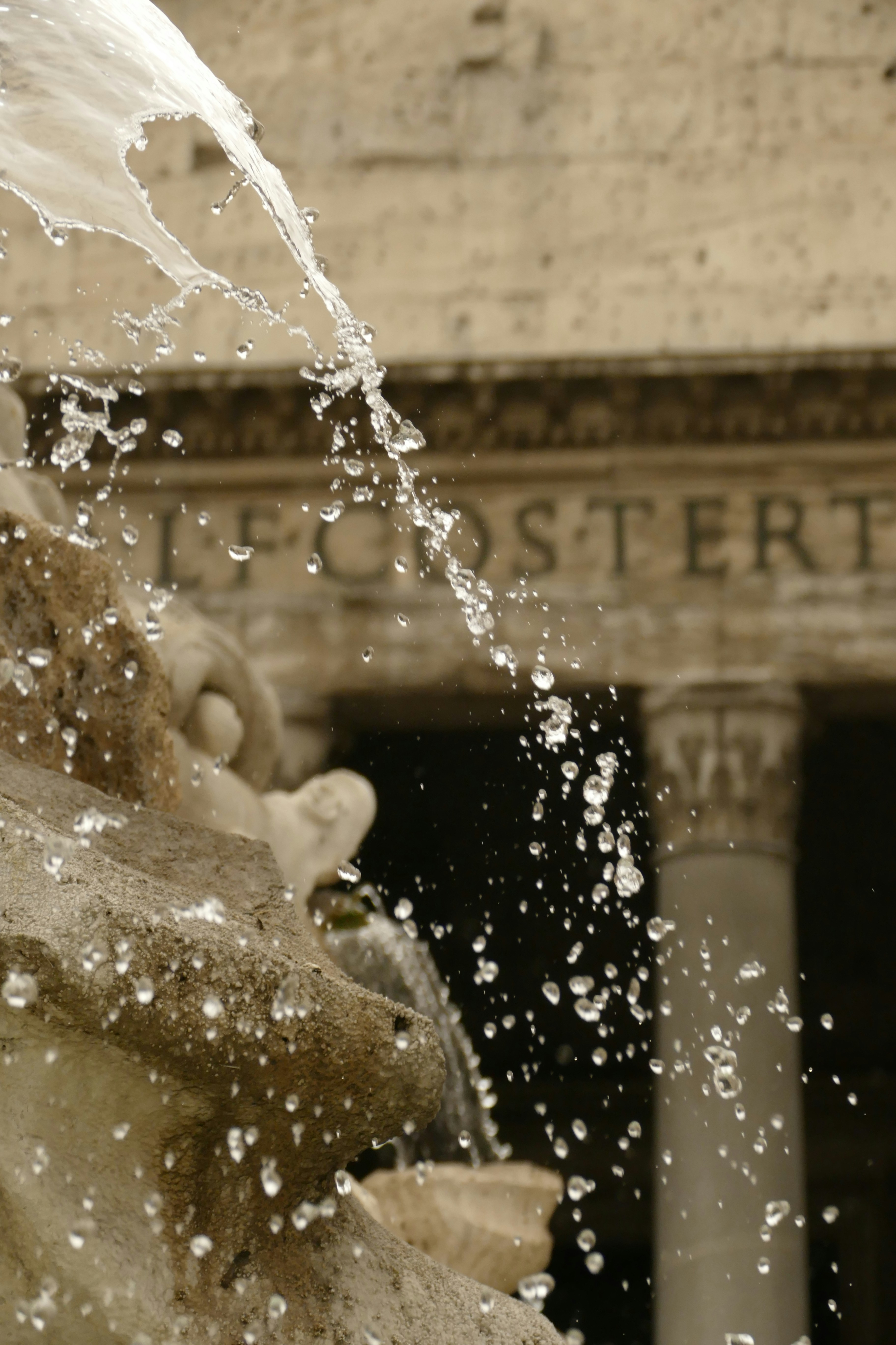 Sepia Spray: An Ancient Fountain Framed by Doric Columns