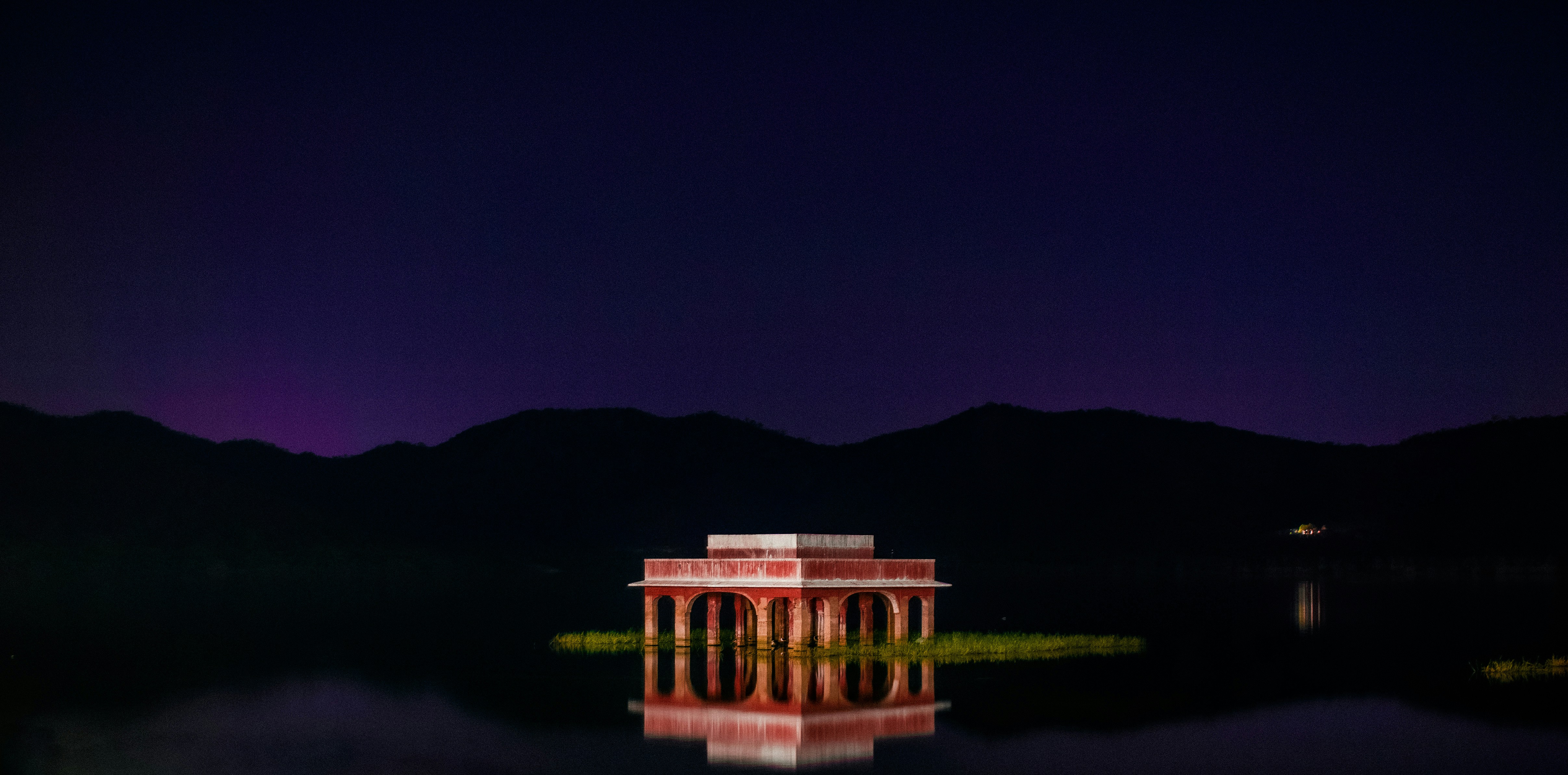 Moonlit Pavilion Quietly Centered on a Glassy Lake