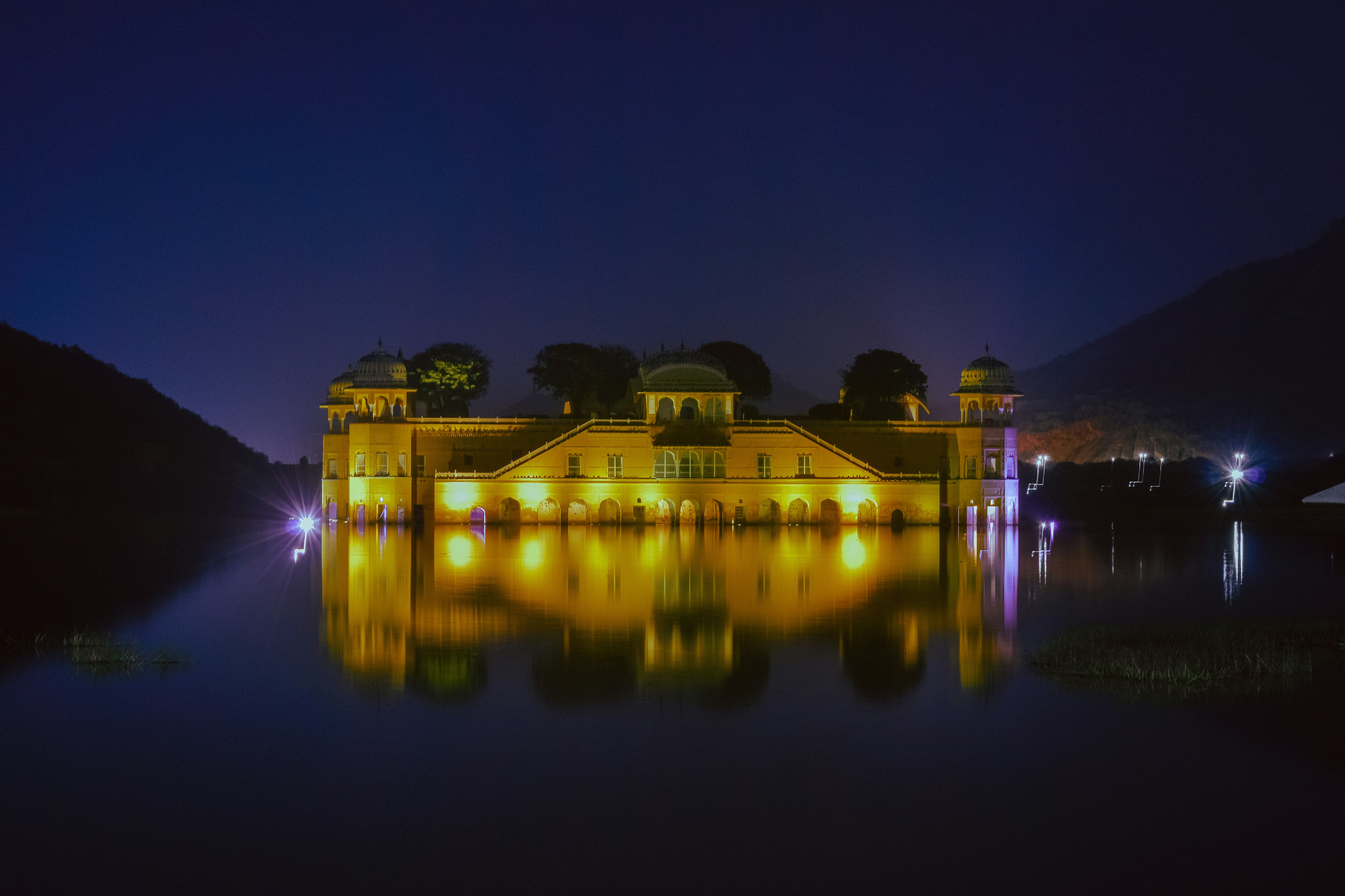 Jal Mahal with lights on at night photo – Free Lake Image on Unsplash