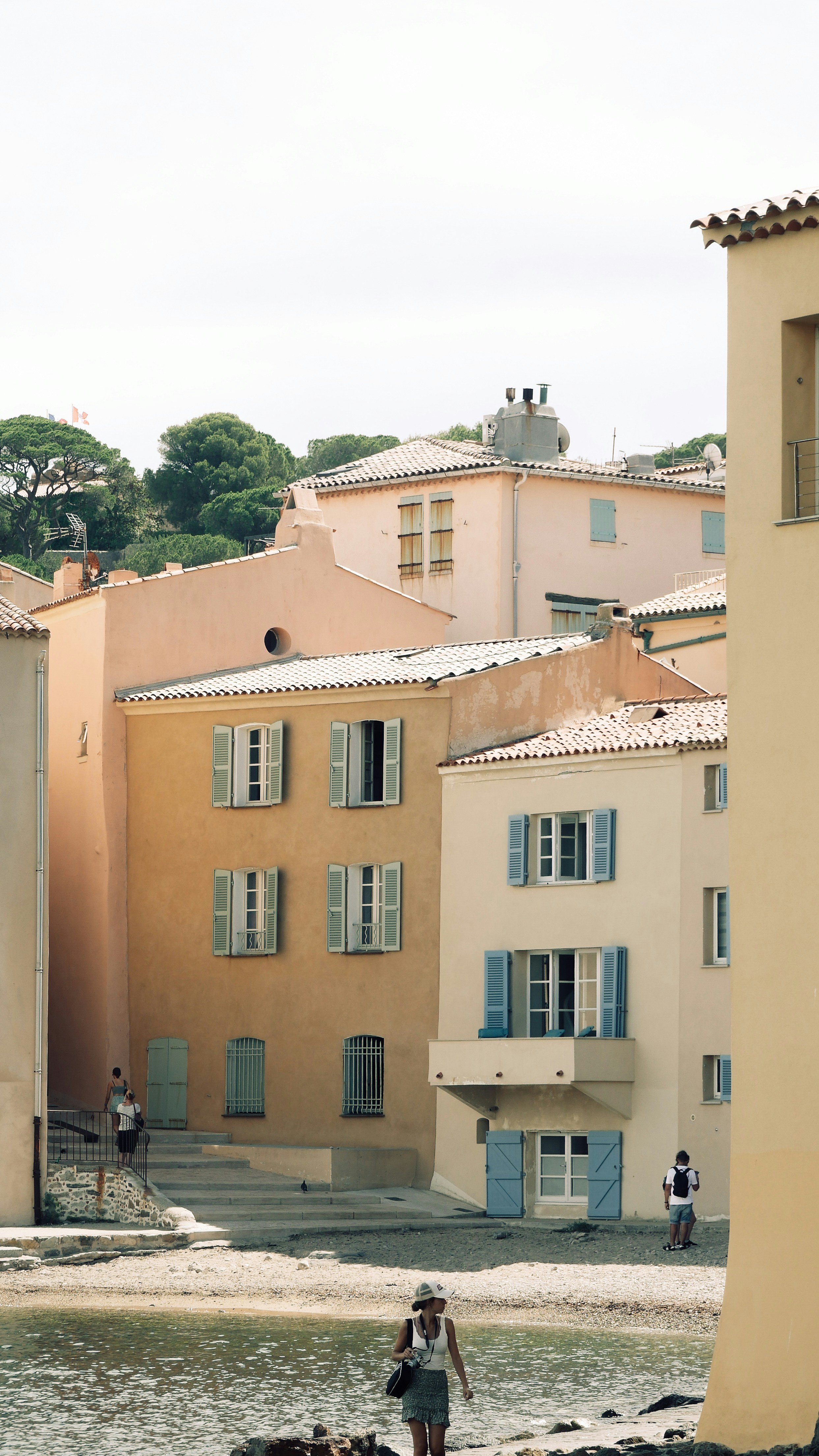 Sunlit Mediterranean Street Framed by pastel facades