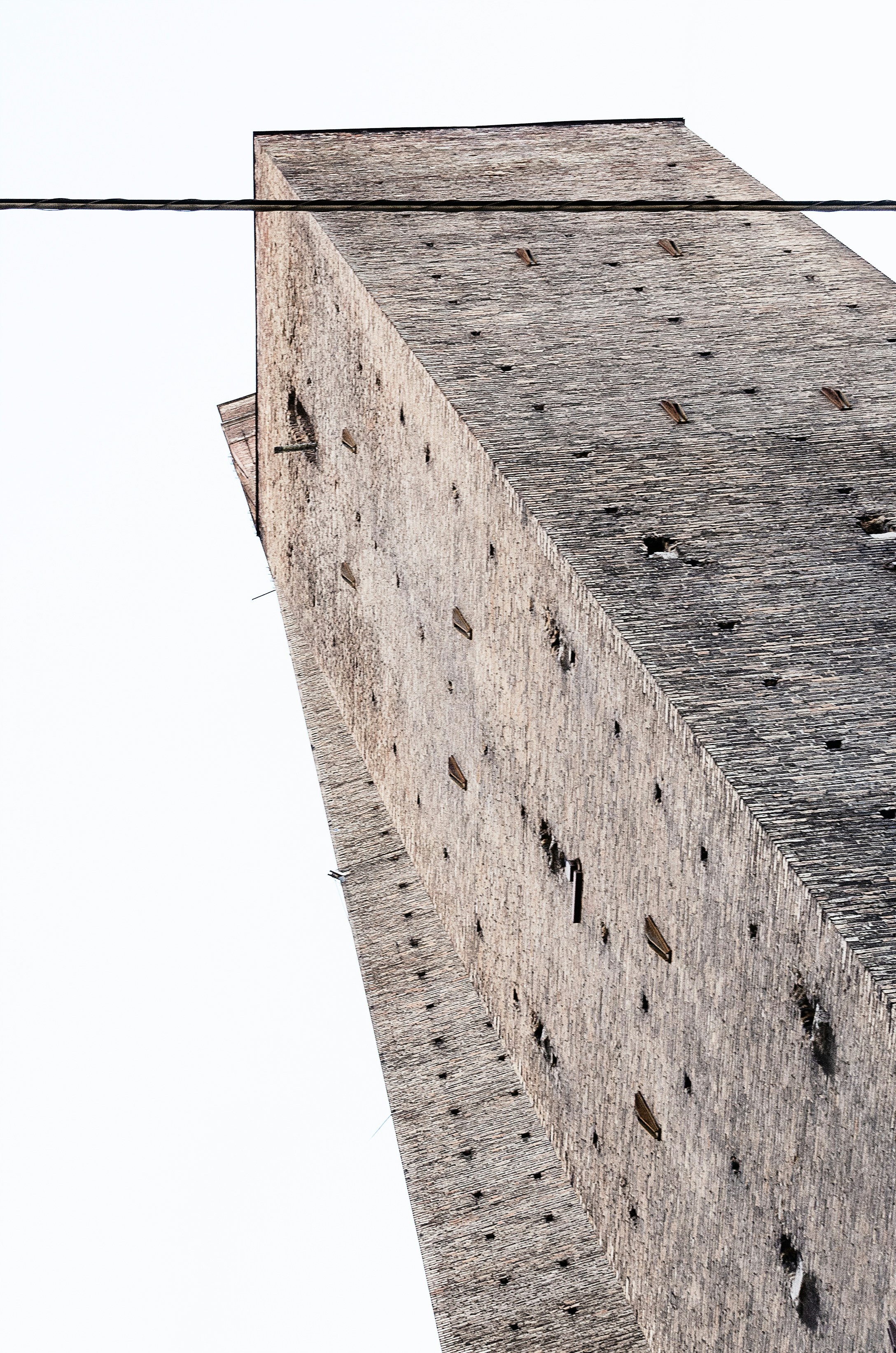 Tilted Brick Monolith Reaching Toward the Sky