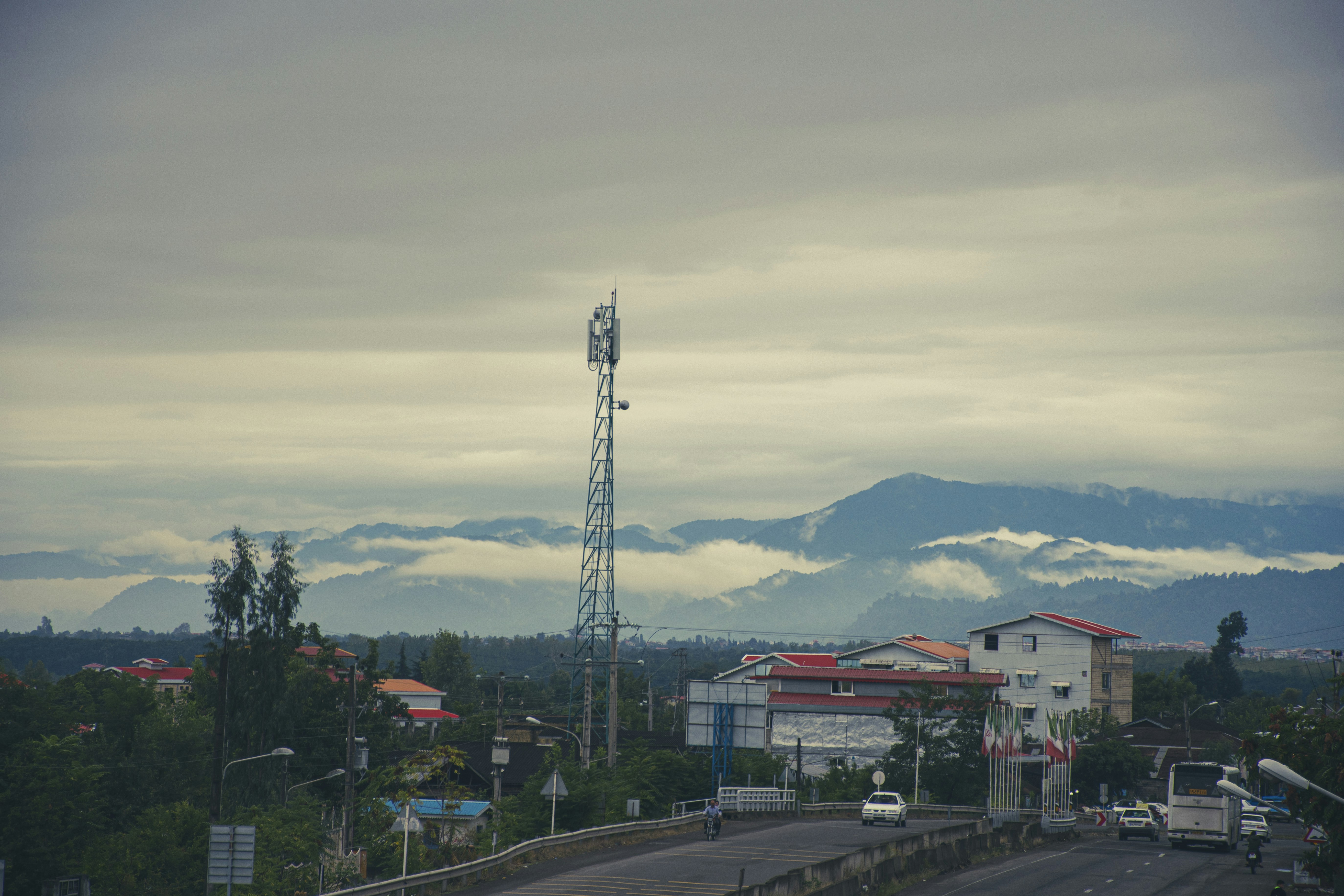 A city with a tower in the background photo – Free Gilan province Image ...