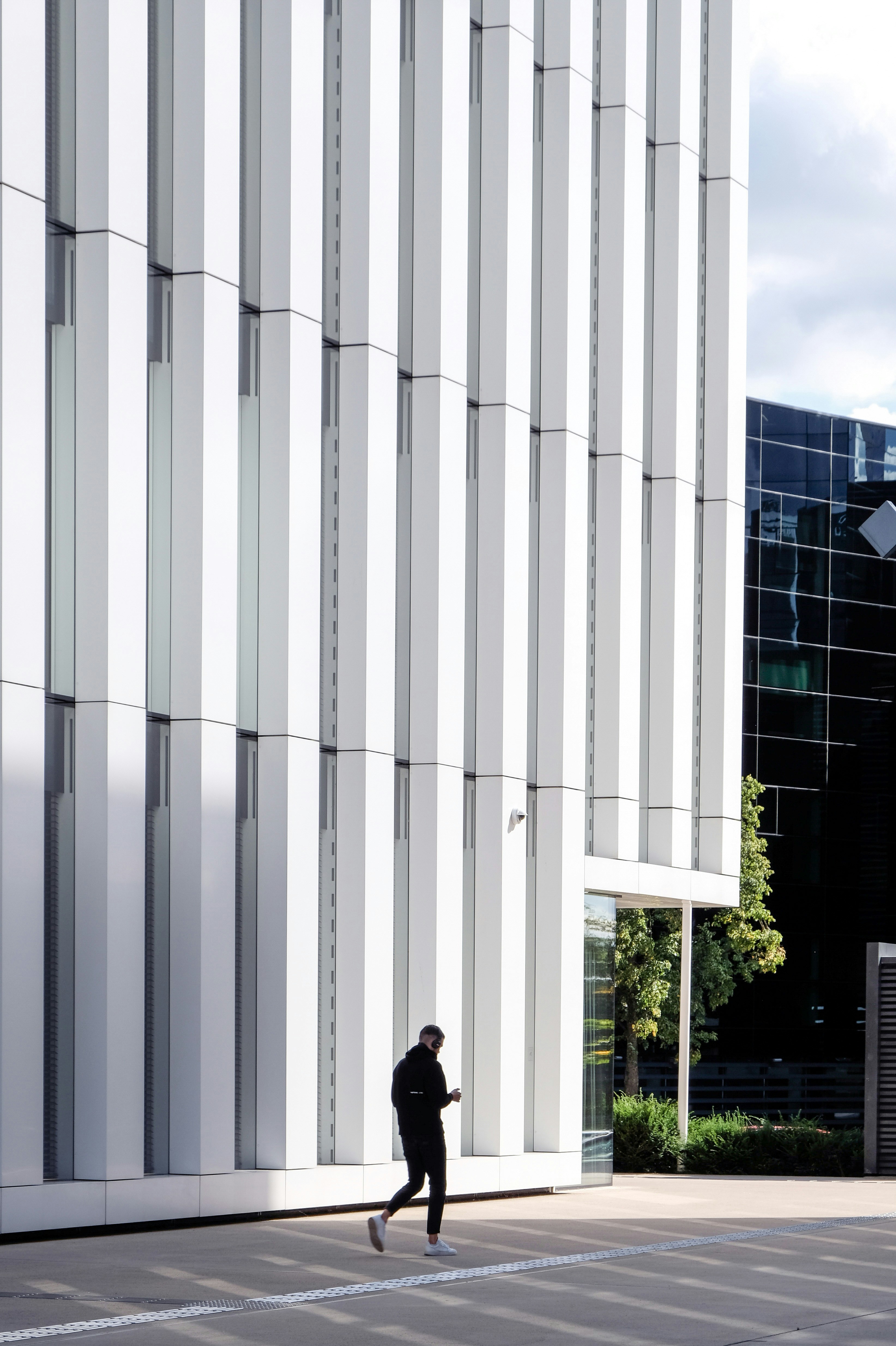 A man running in front of a building photo – Free Image on Unsplash