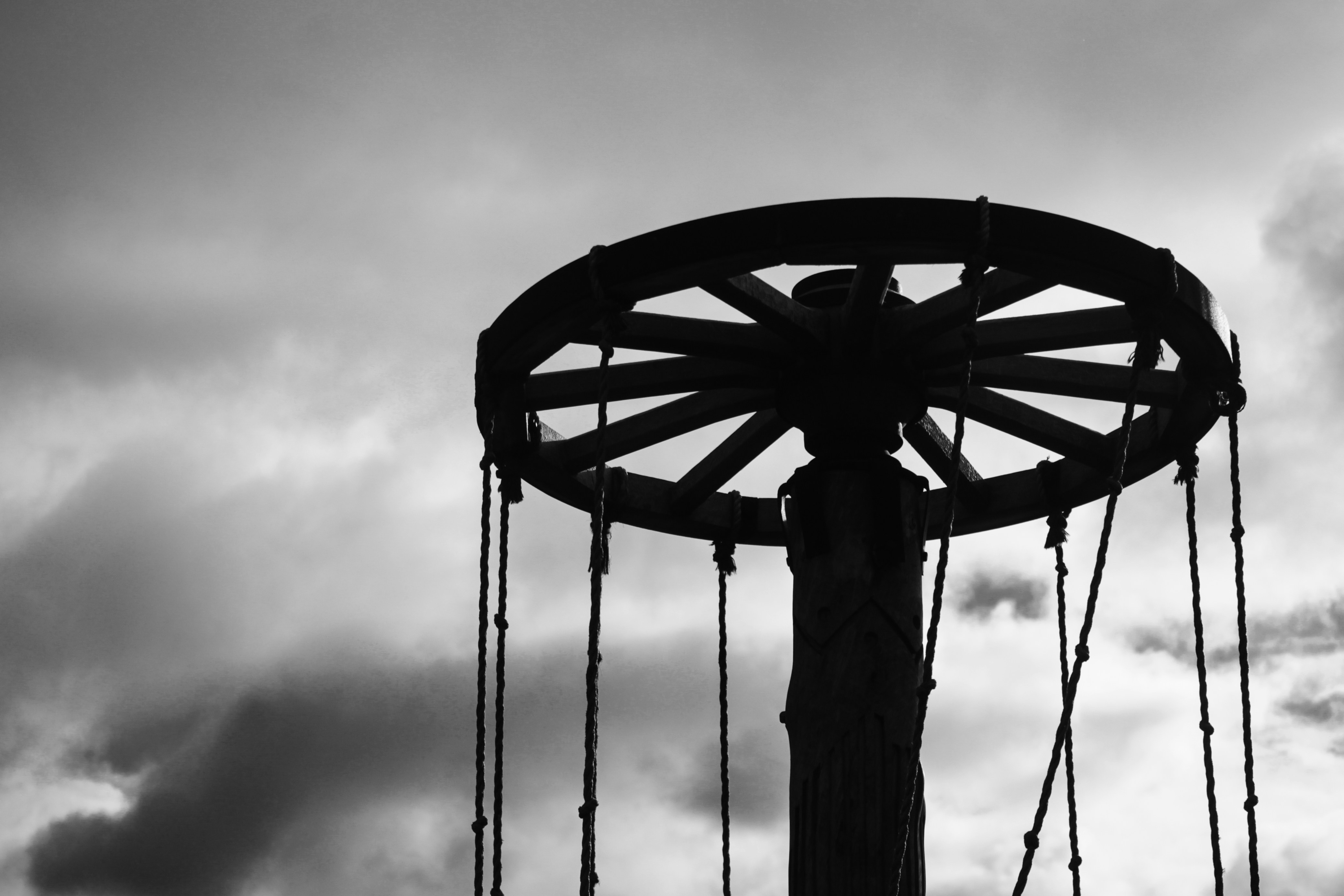 a water tower with a cloudy sky