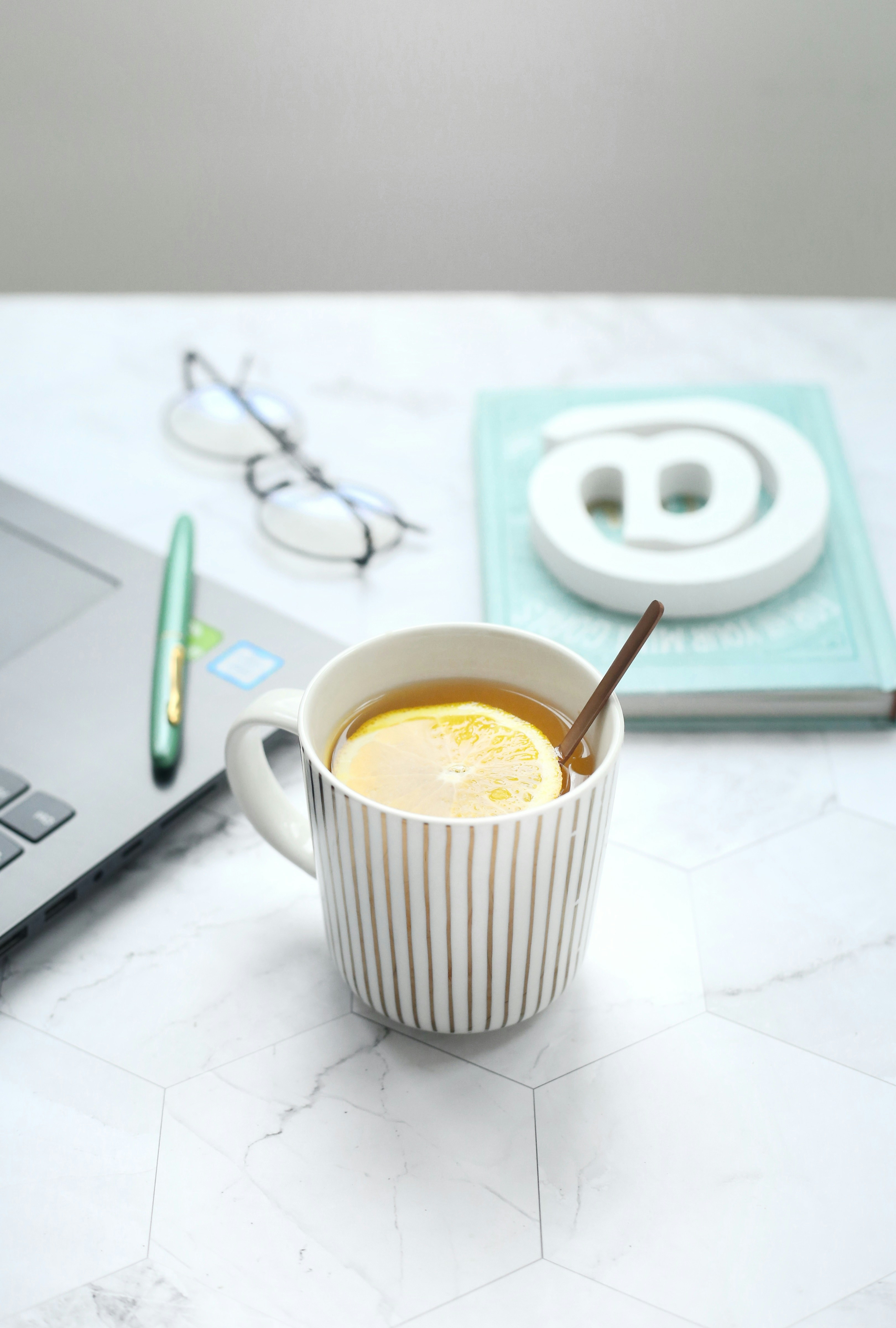 A cup of tea on a laptop photo – Free Bowl Image on Unsplash