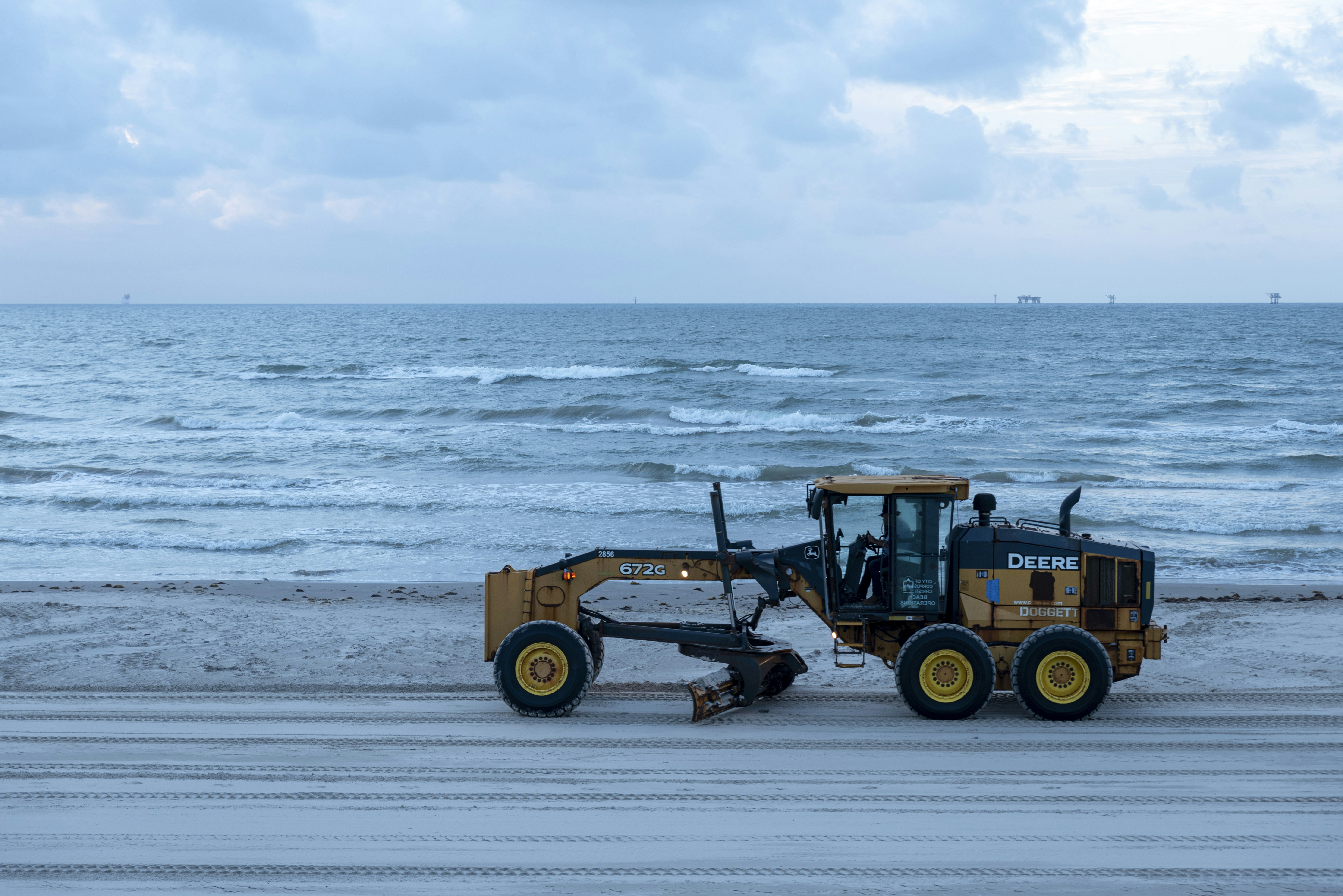 Sidecar on the Shore: a Loader Resting on the Quiet Beach