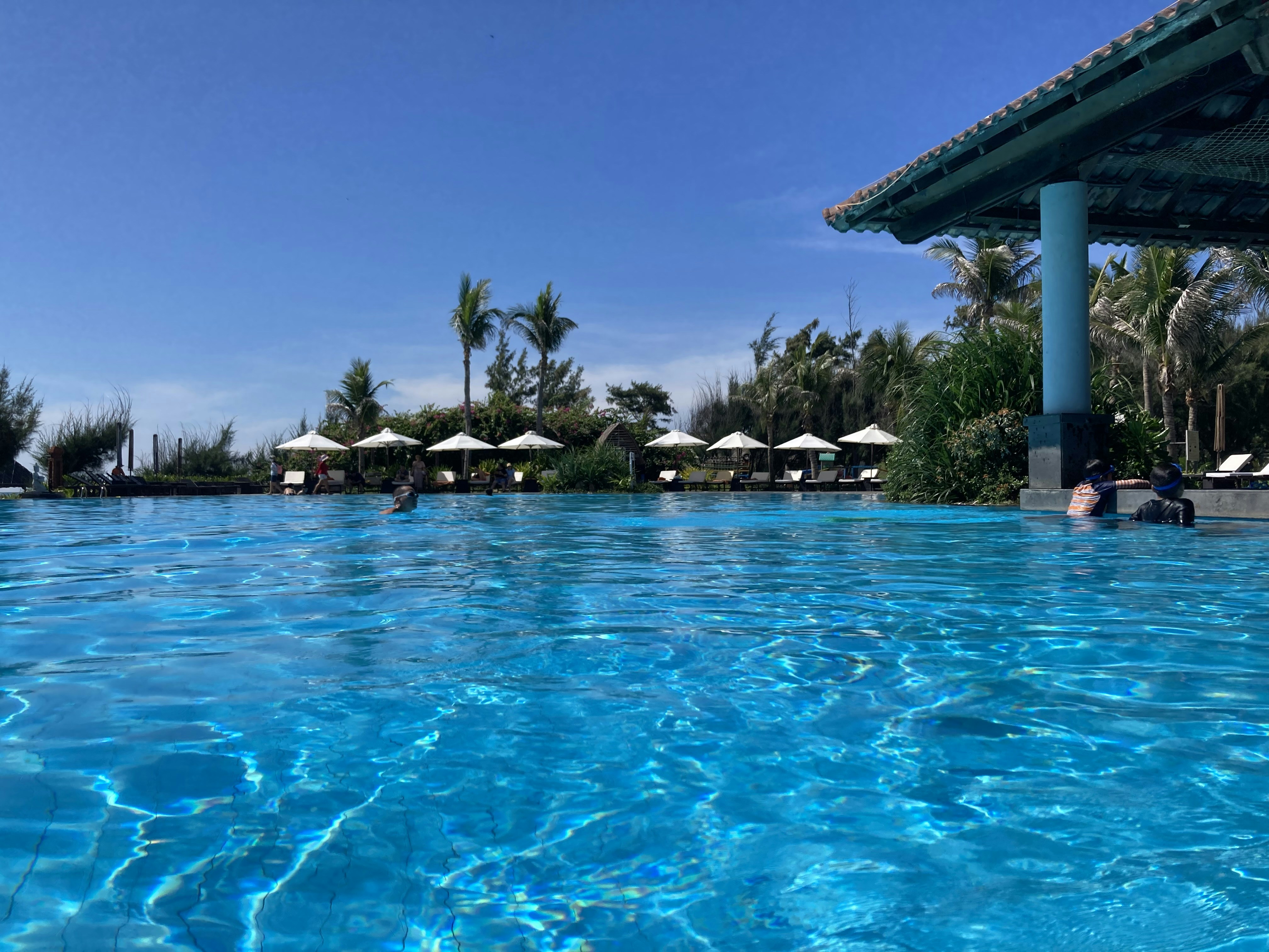 A pool with a structure in the background photo – Free Land Image on ...