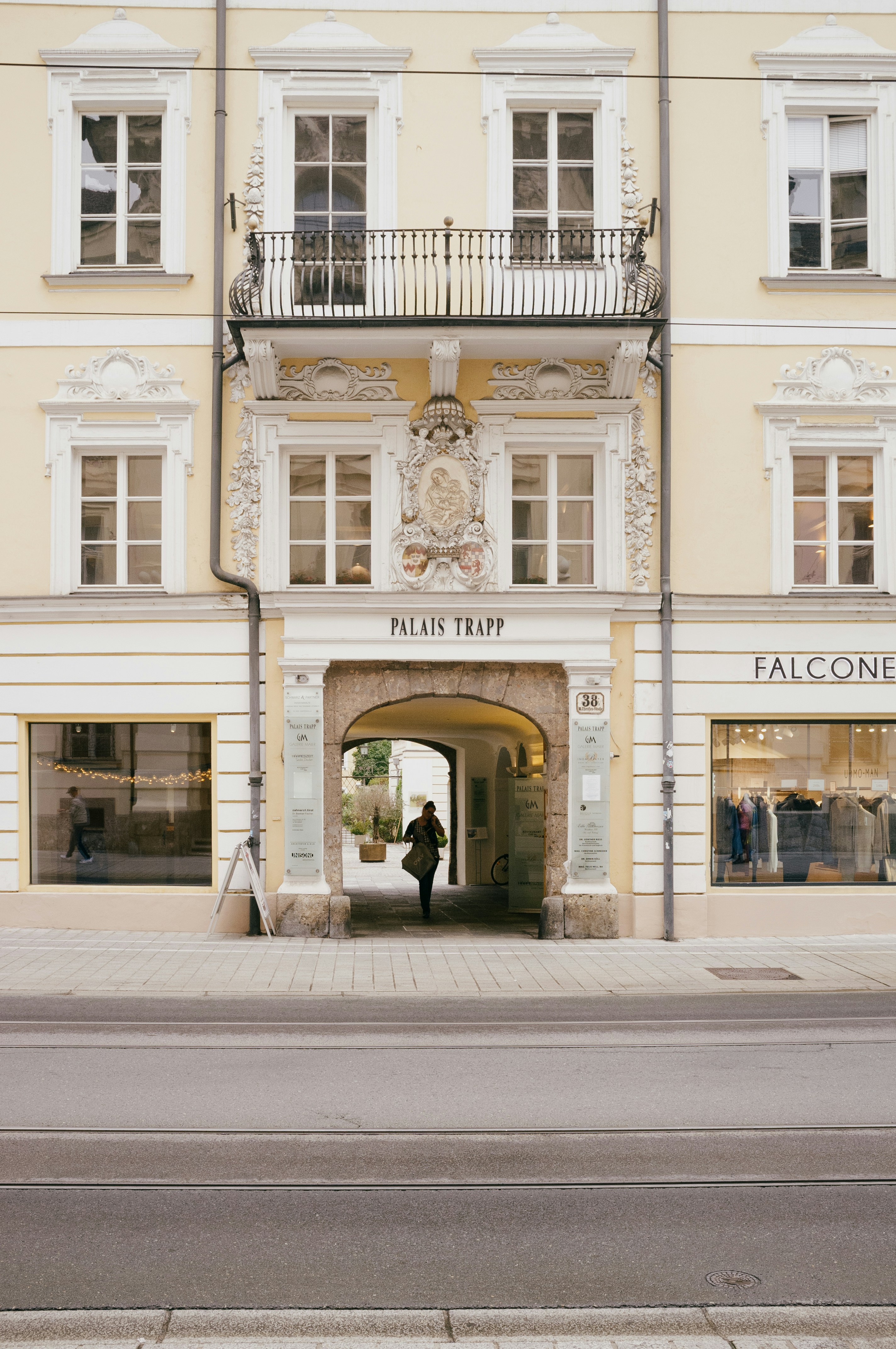 A person walking out of a building photo – Free Innsbruck Image on Unsplash
