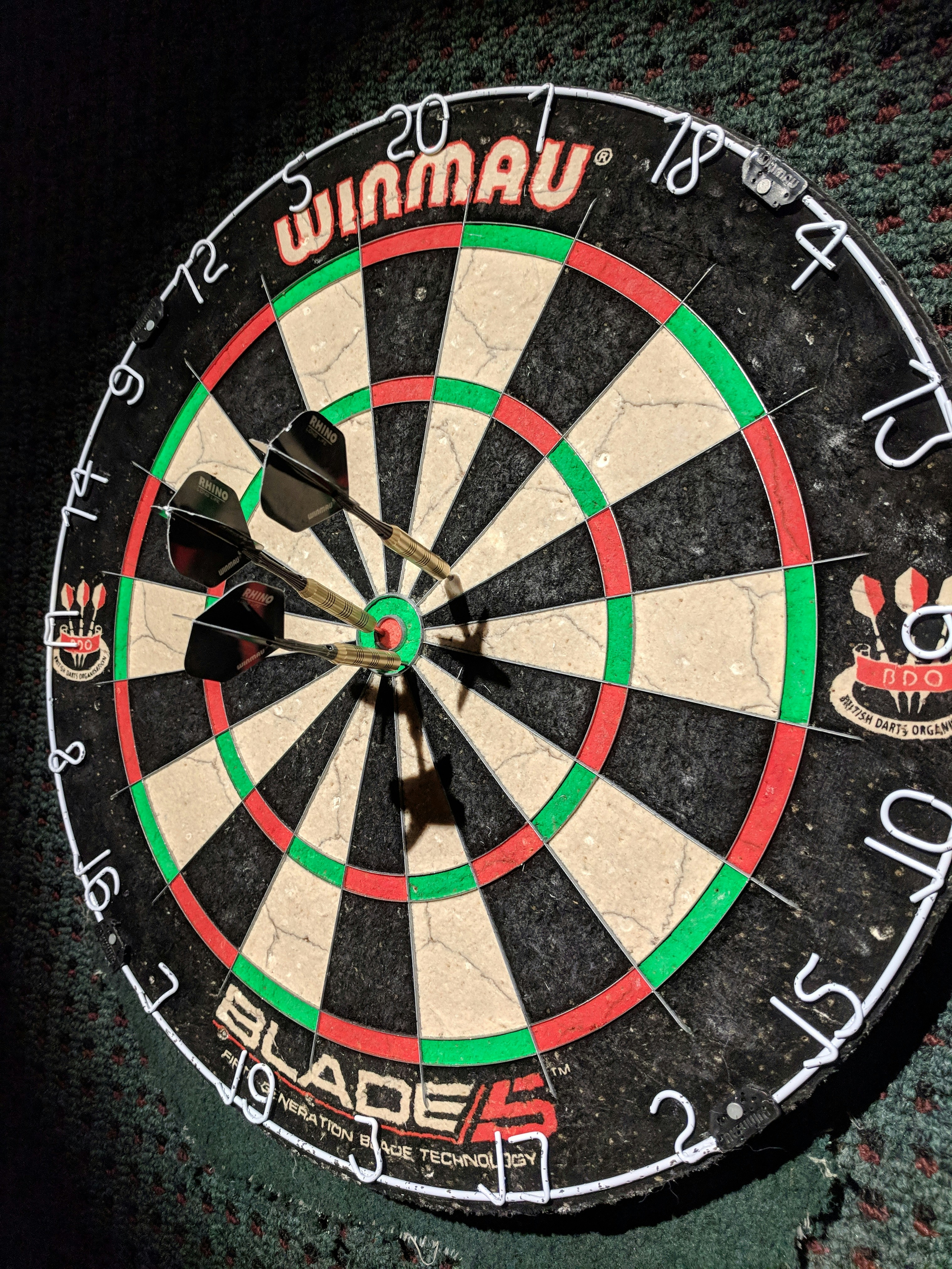 A dart board with darts photo – Free Image on Unsplash