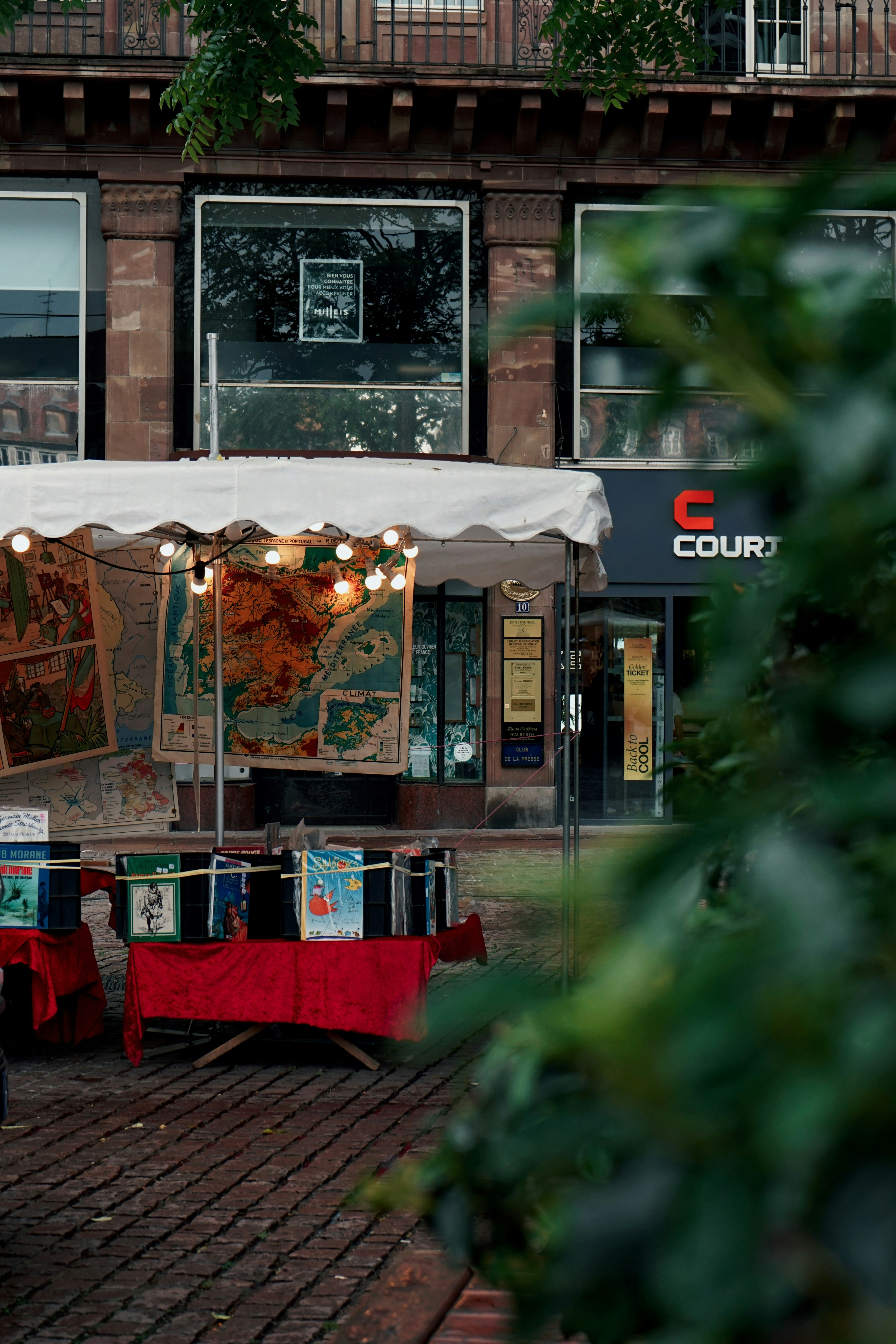 Market Map Under an Awning in Front of a Courthouse Building