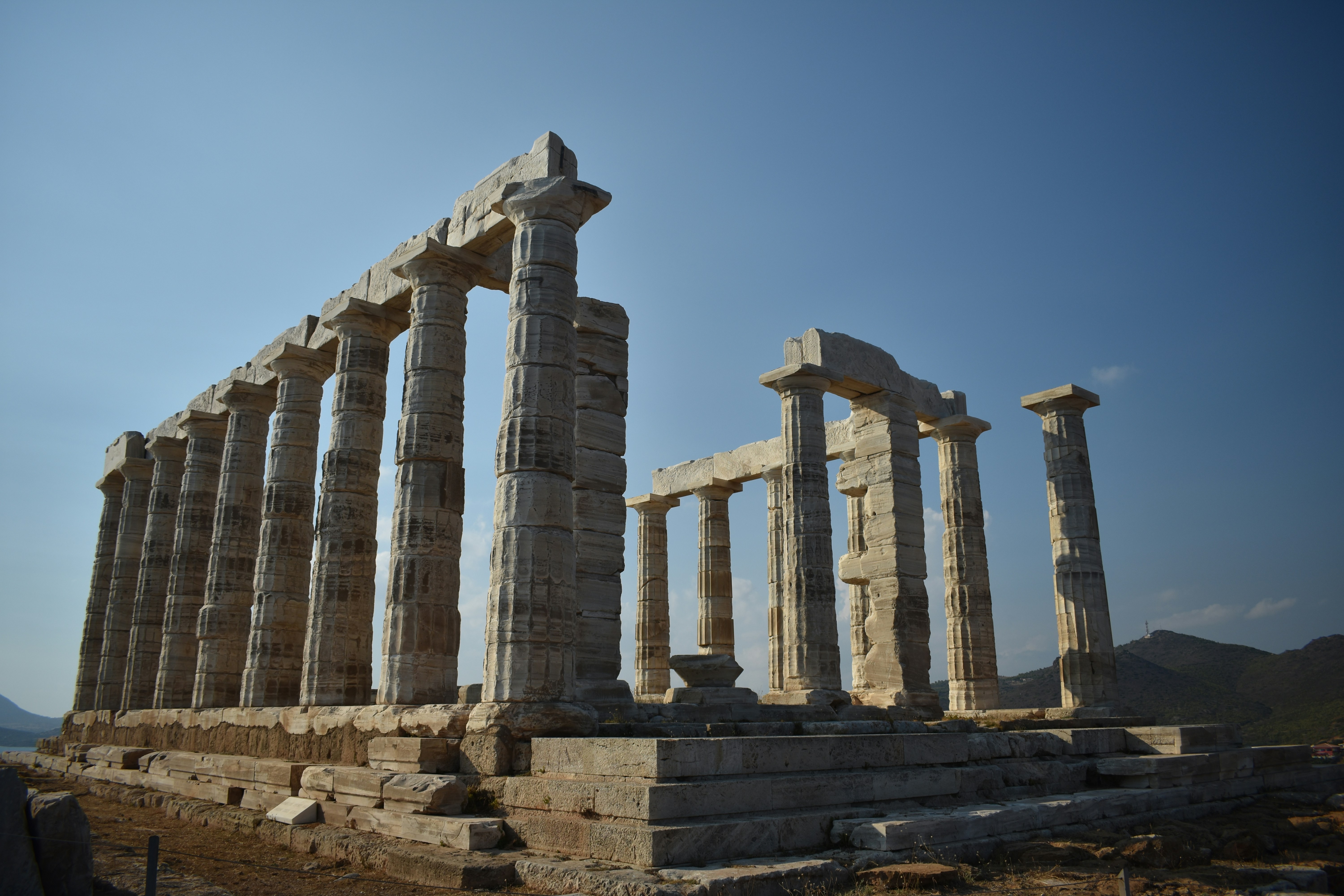 A stone building with pillars photo – Free Temple of poseidon Image on ...