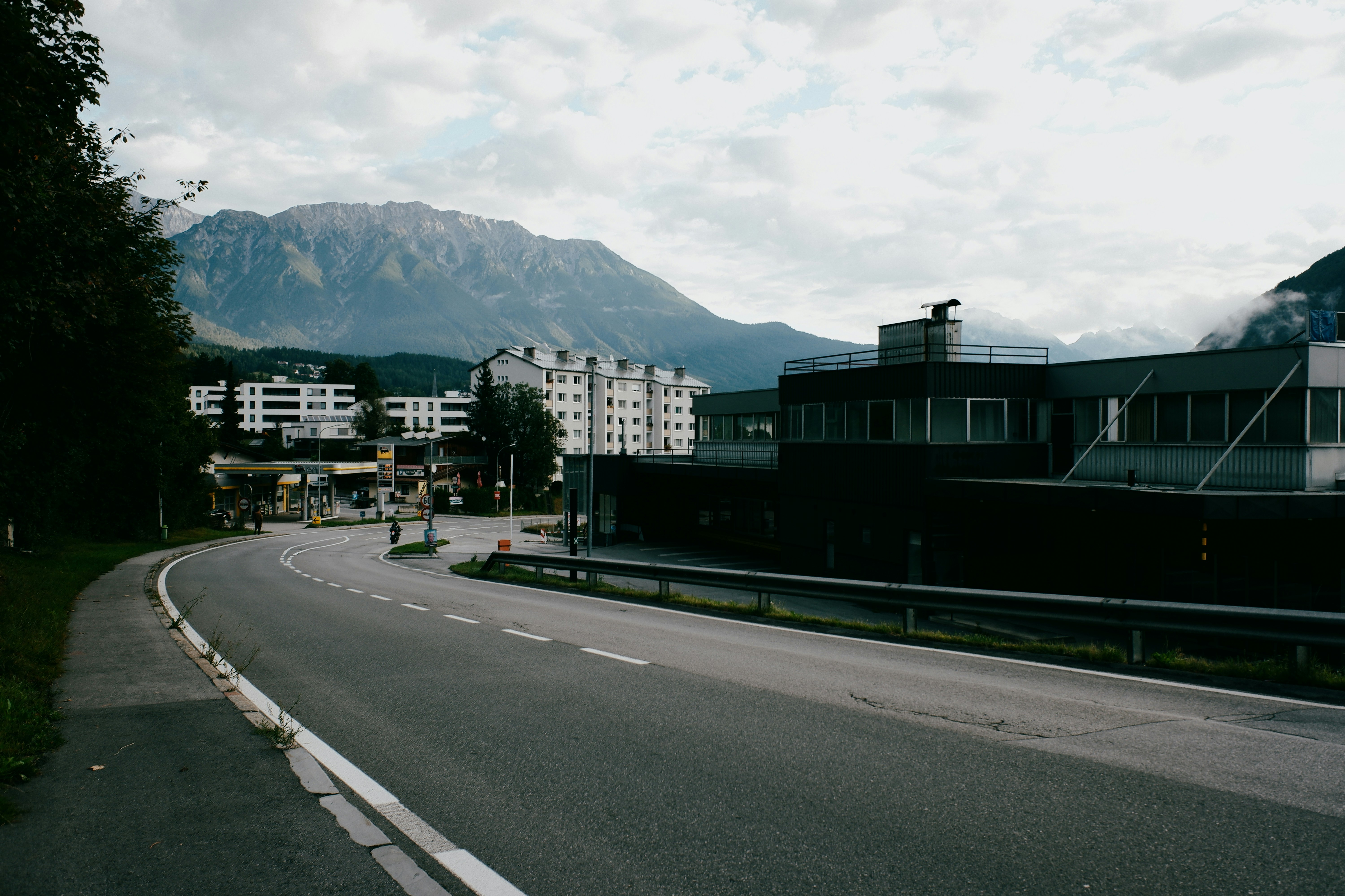 A road with buildings and trees on the side photo – Free Imst Image on ...