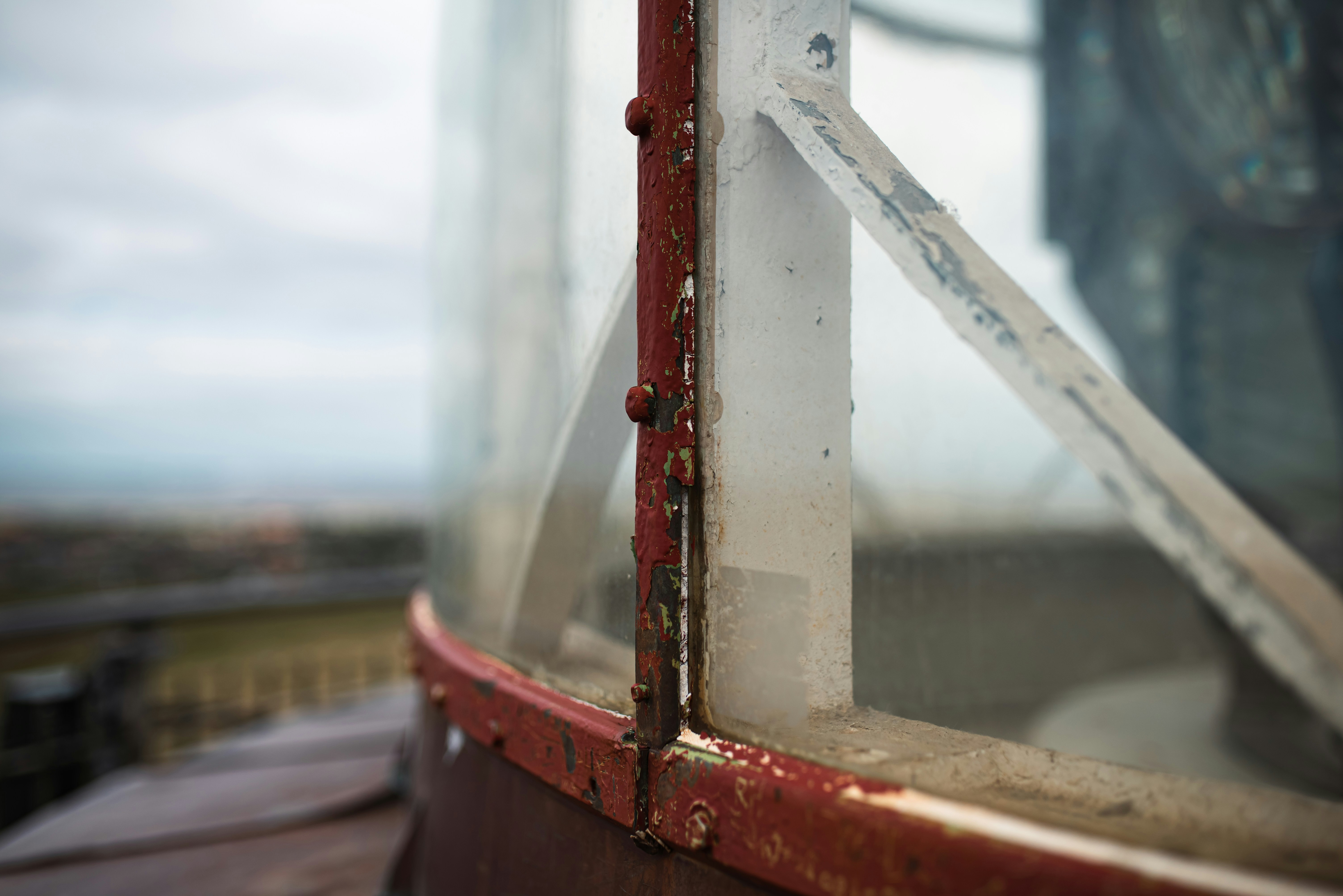 Weathered Red Window on a Quiet Skyline