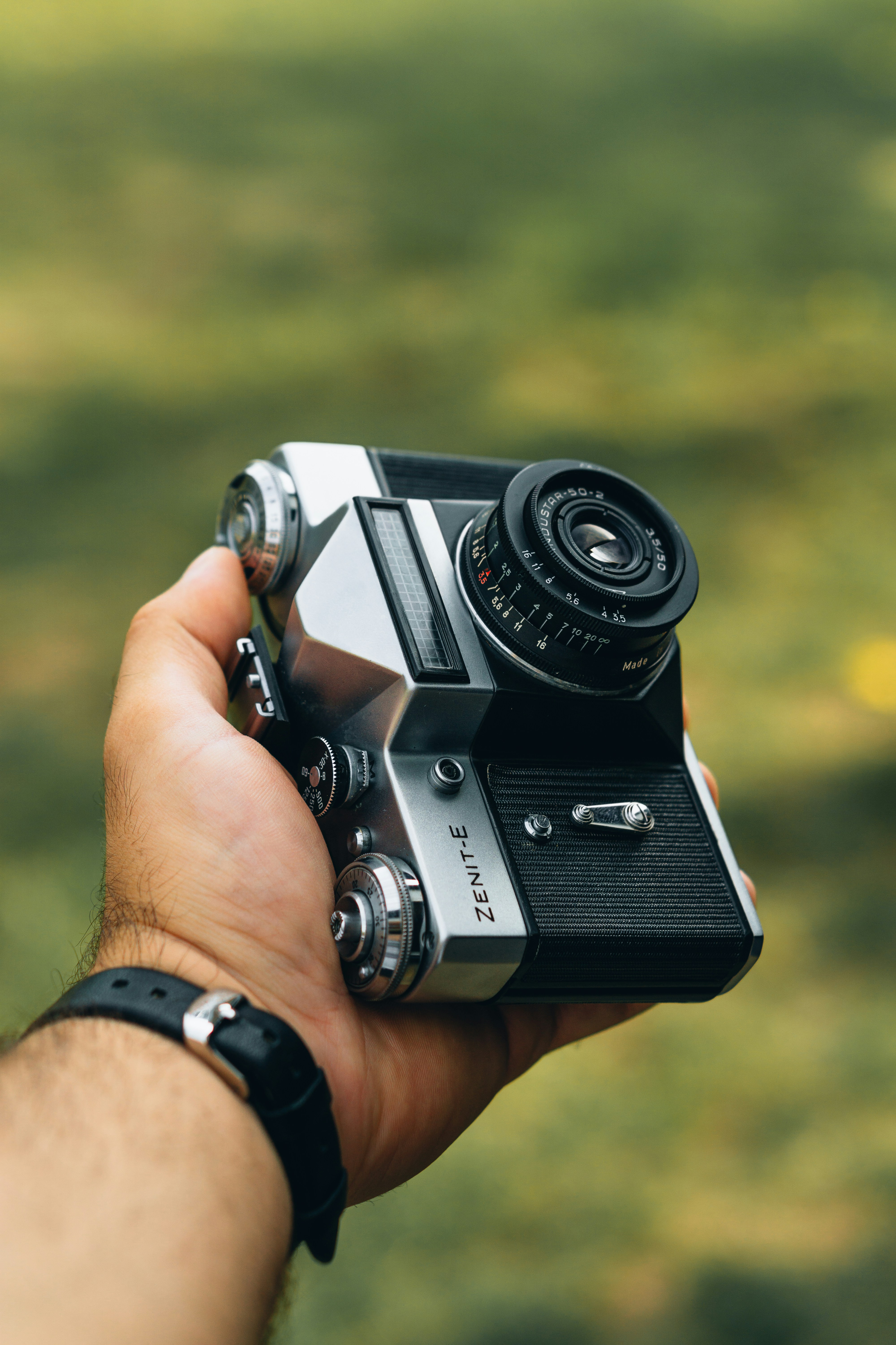 A hand holding a camera photo – Free Bokeh Image on Unsplash
