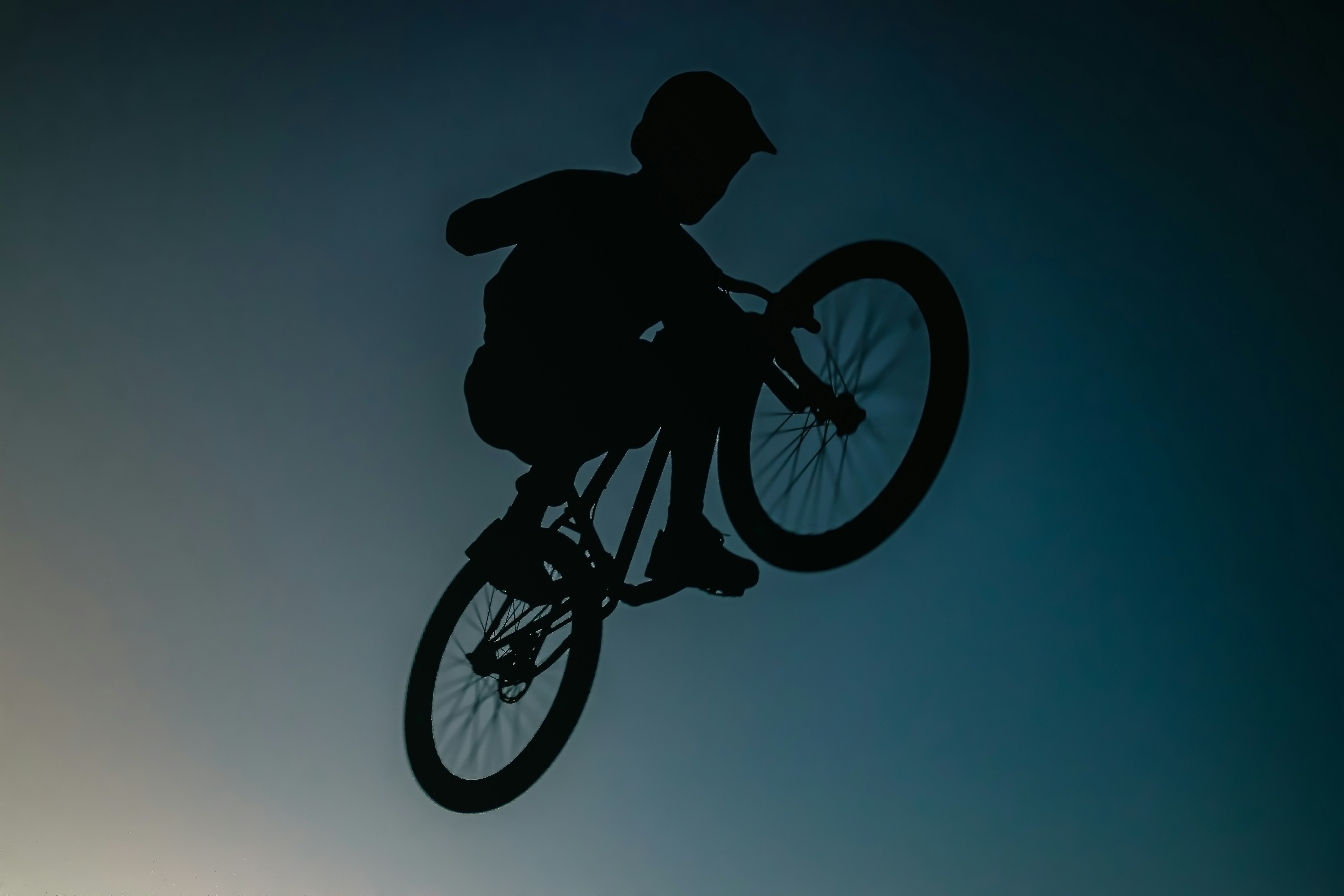 A person riding a bike photo – Free Desktop wallpapers Image on Unsplash