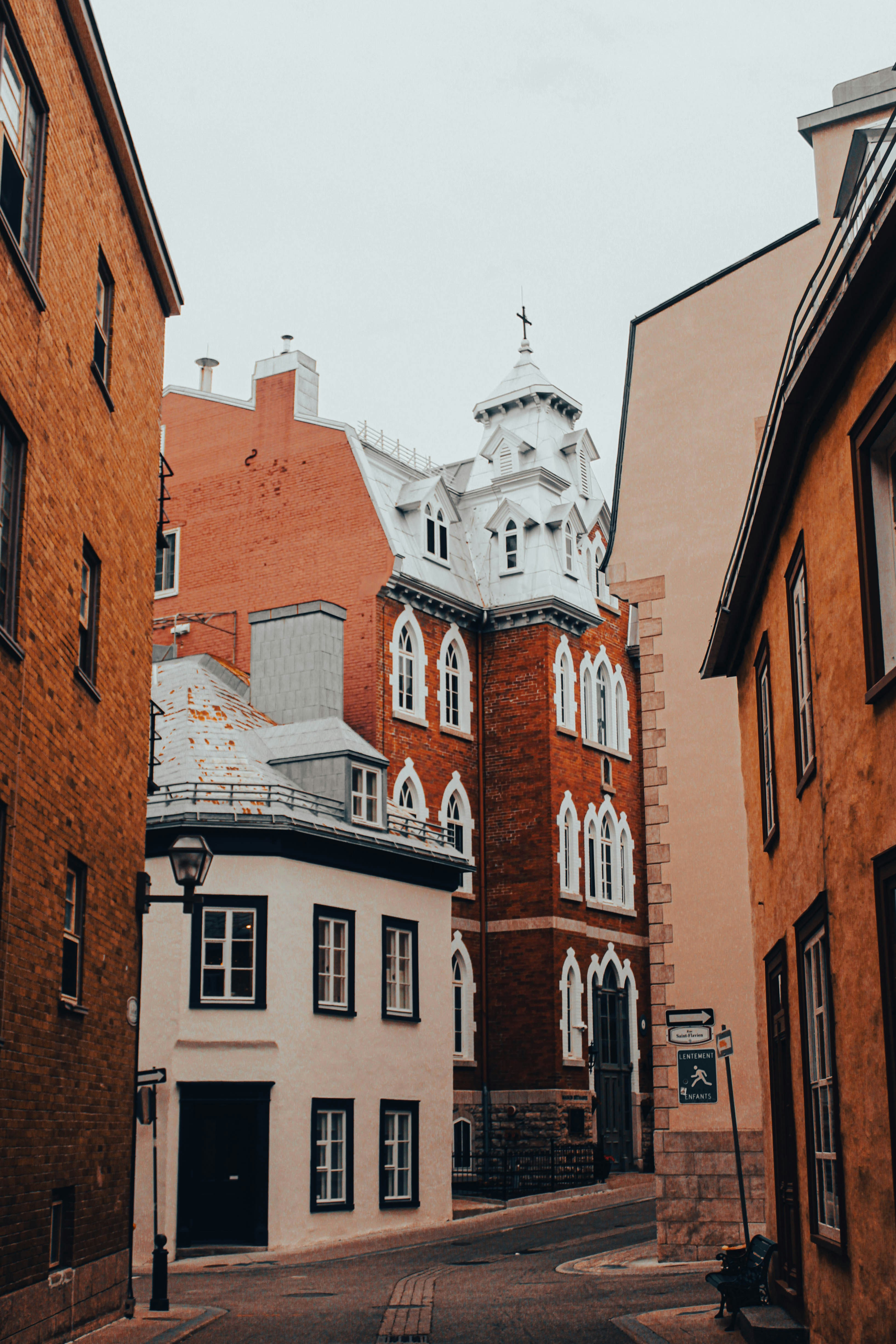 A brick building with a cross on top photo – Free Architecture Image on ...