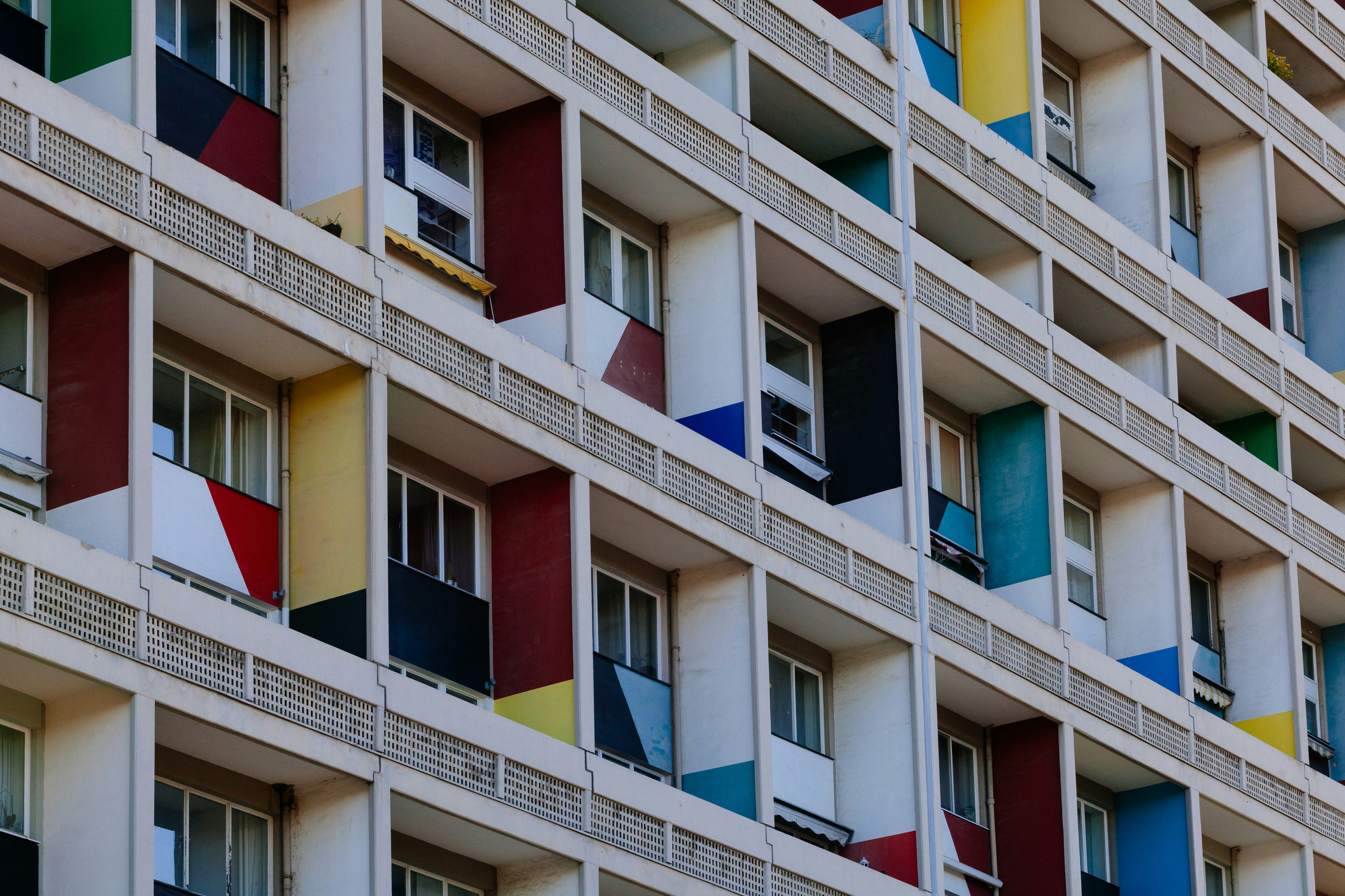 Chromatic Grid: Bold Balcony Blocks on a Modern Facade