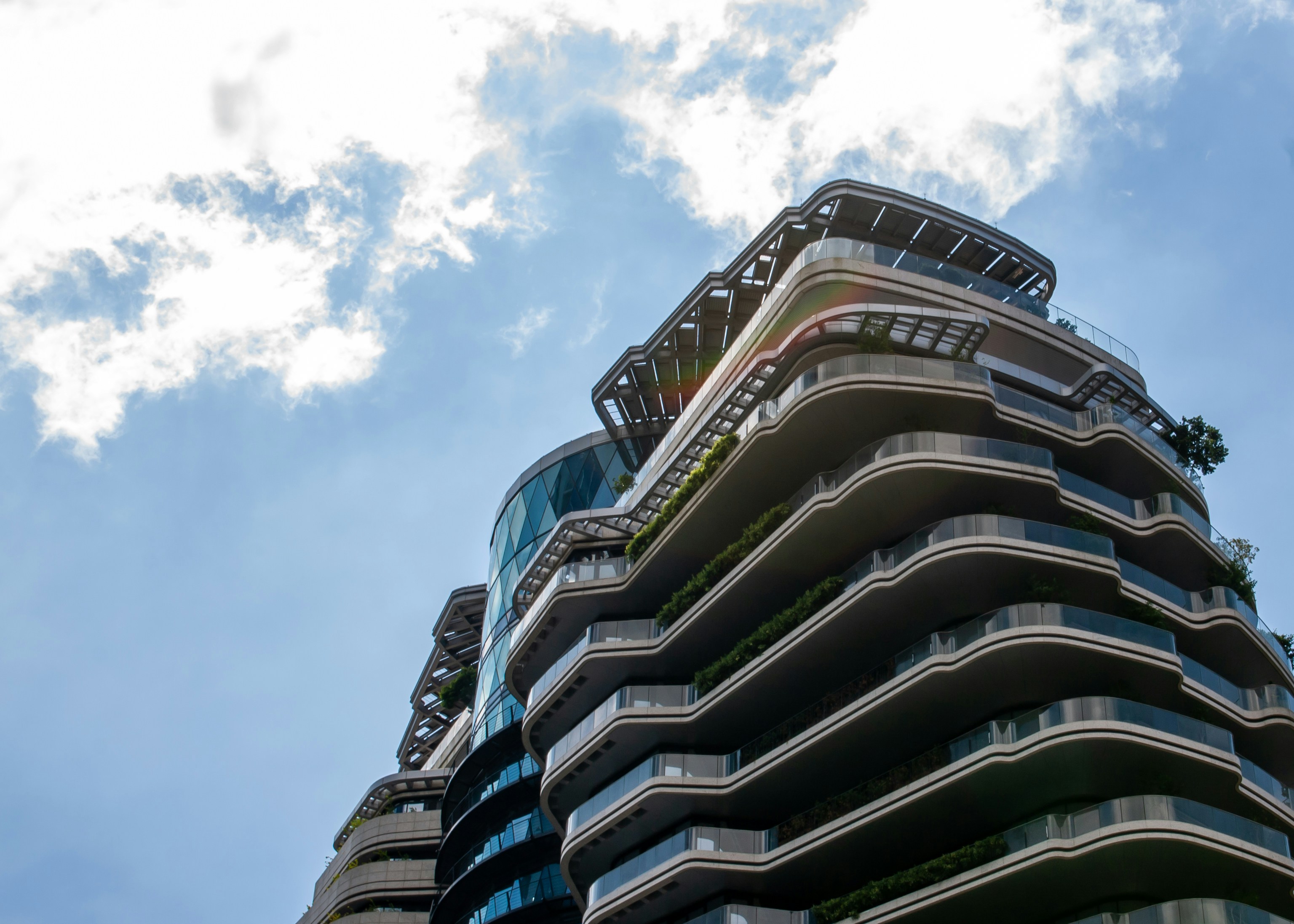 Vertical Quilt of Curved Balconies Reaches the Sky
