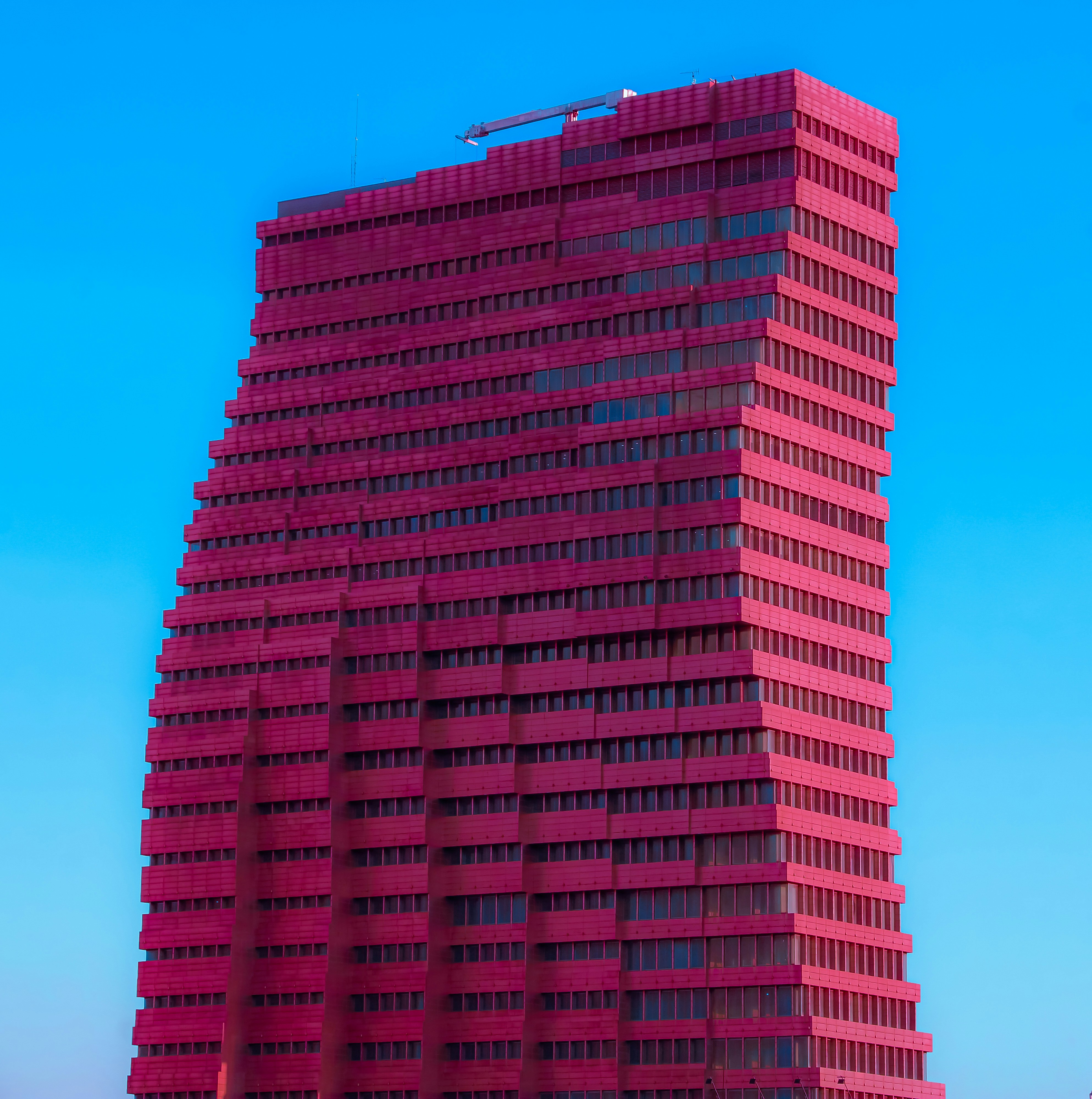 A tall building with a crane photo – Free Tehran province Image on Unsplash