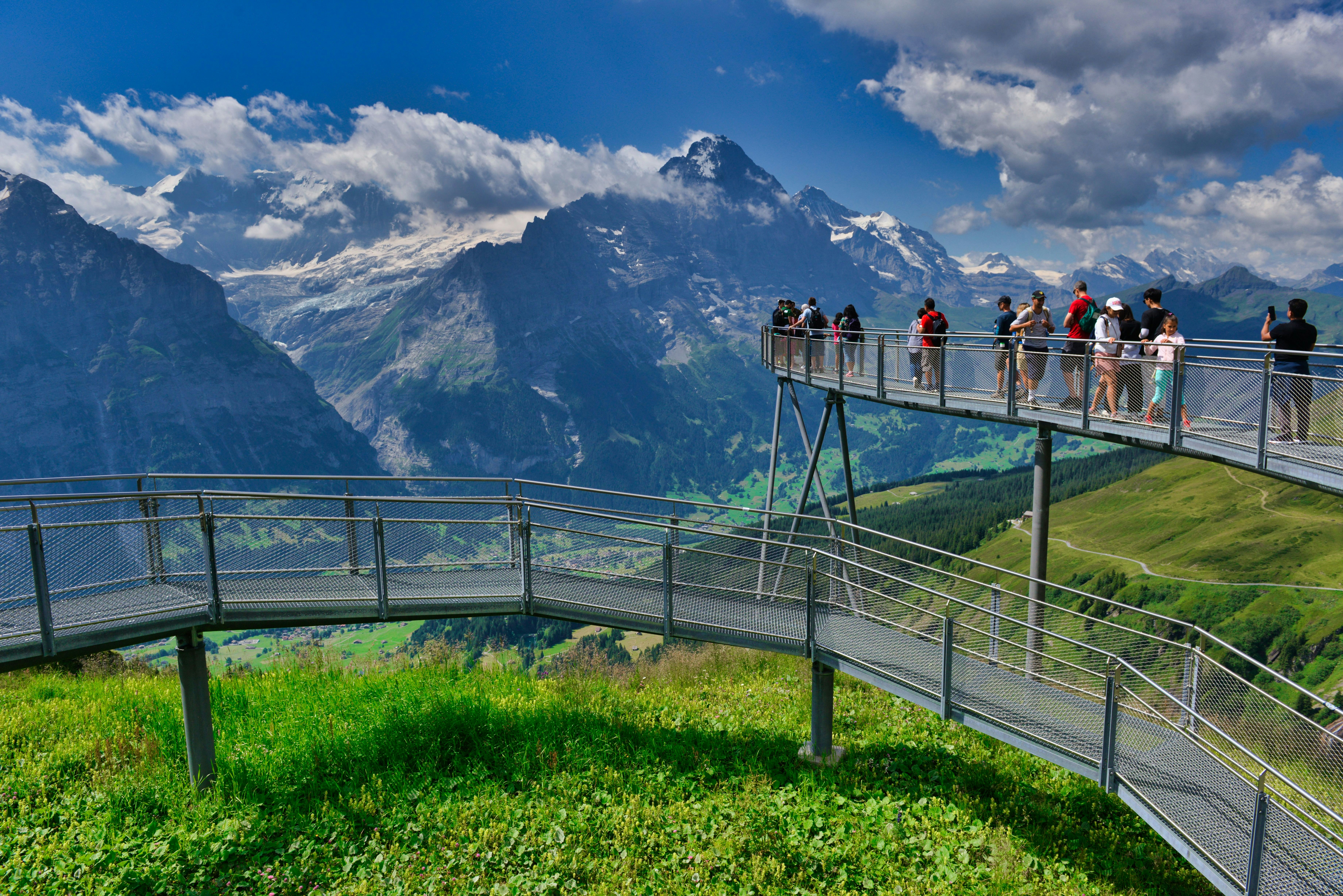 A group of people on a bridge photo – Free Grindelwald Image on Unsplash