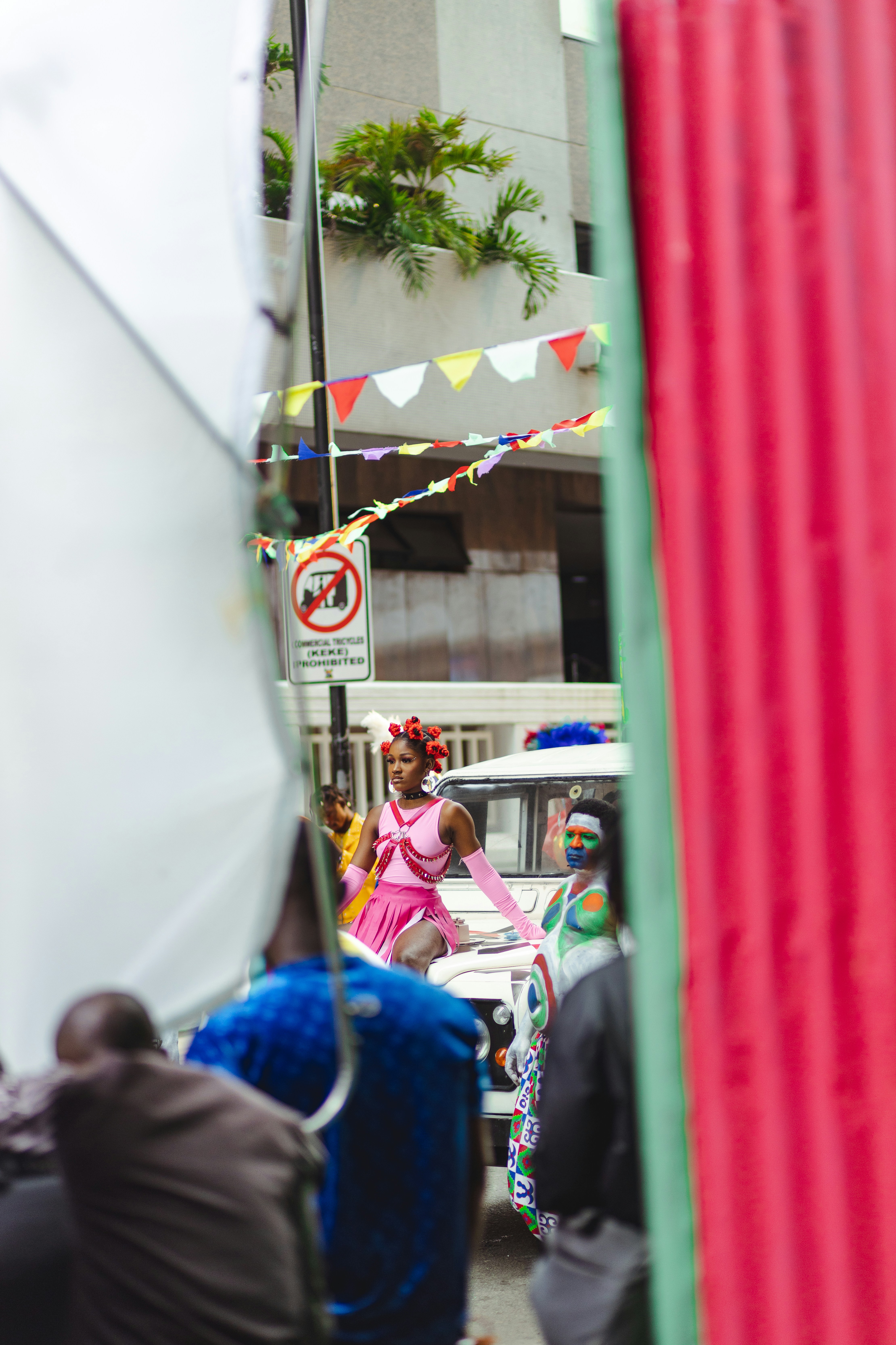 Carnival Portrait in an Alleyway Between Colorful Corridors