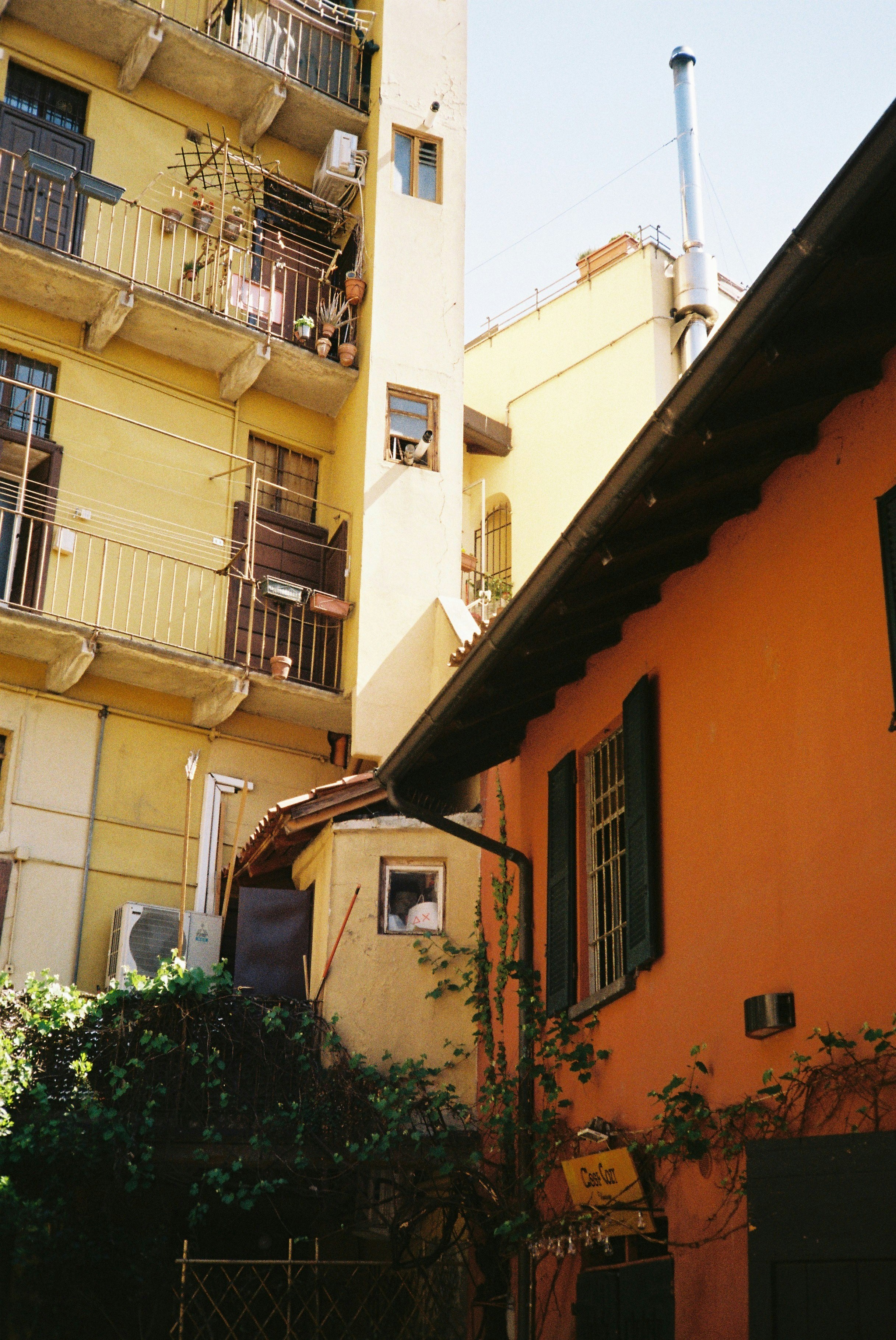 A building with balconies and plants in front of it photo – Free Milano ...