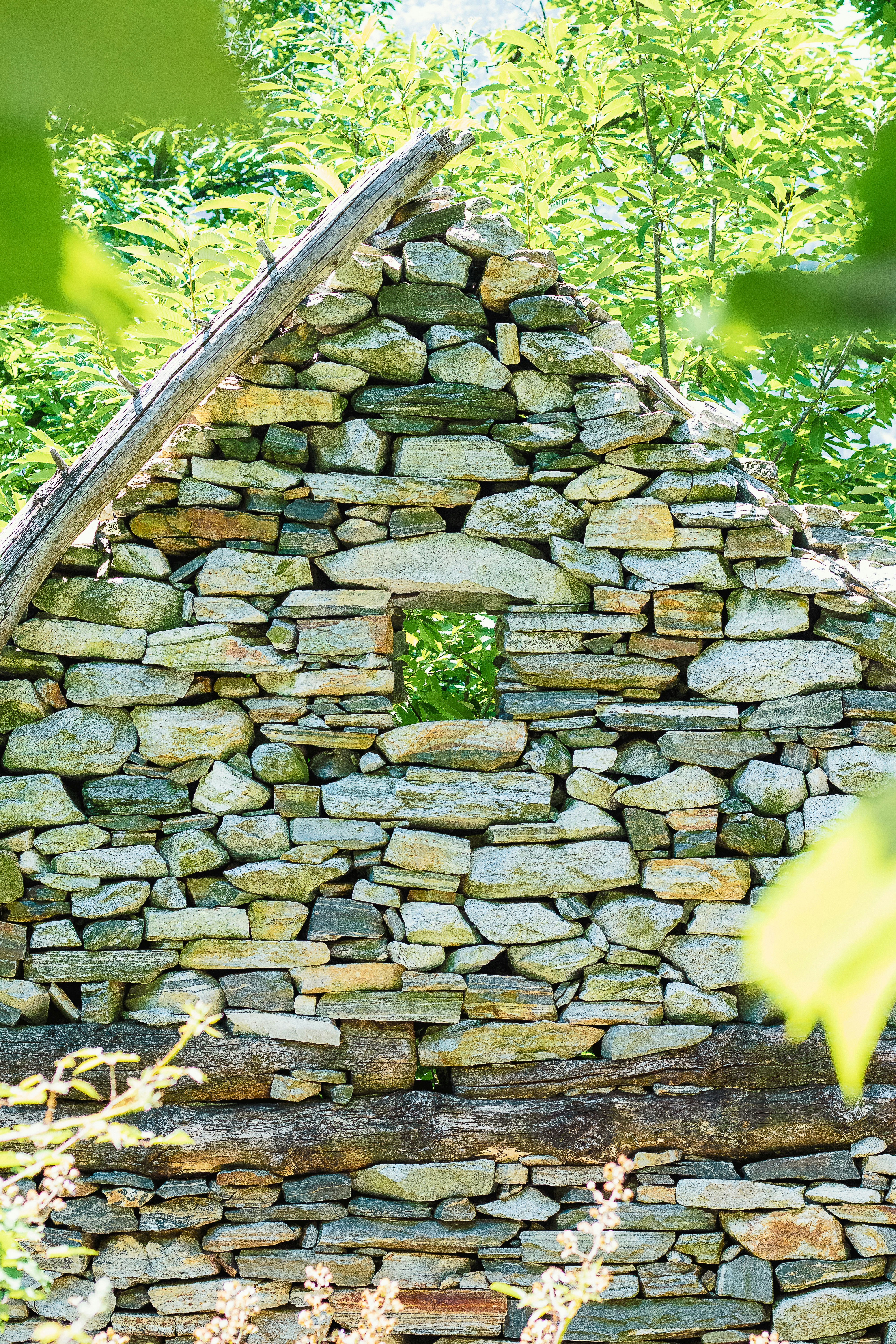 a stone wall with a stone walkway