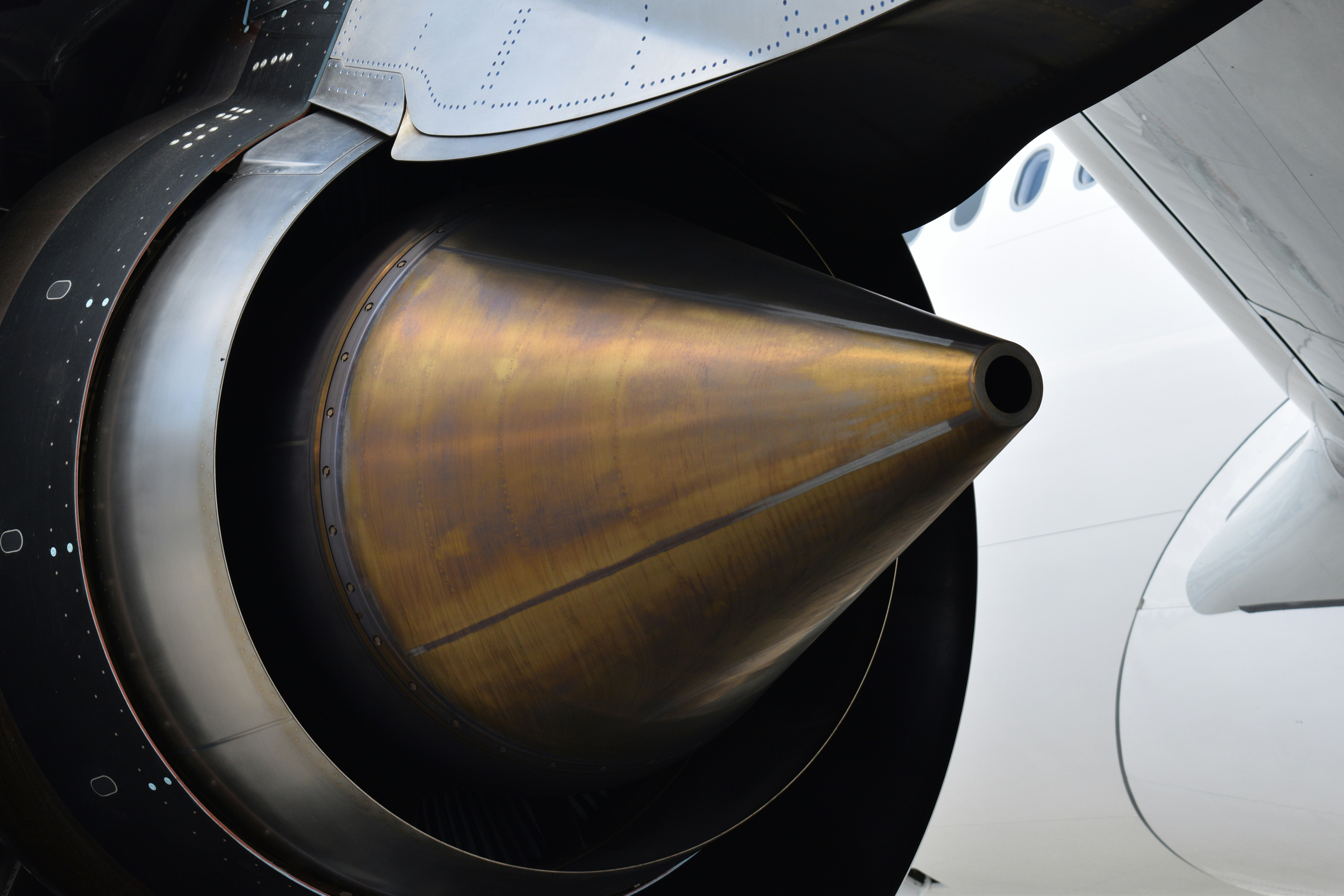 Detailed view of a jet engine's spinner cone and surrounding components.