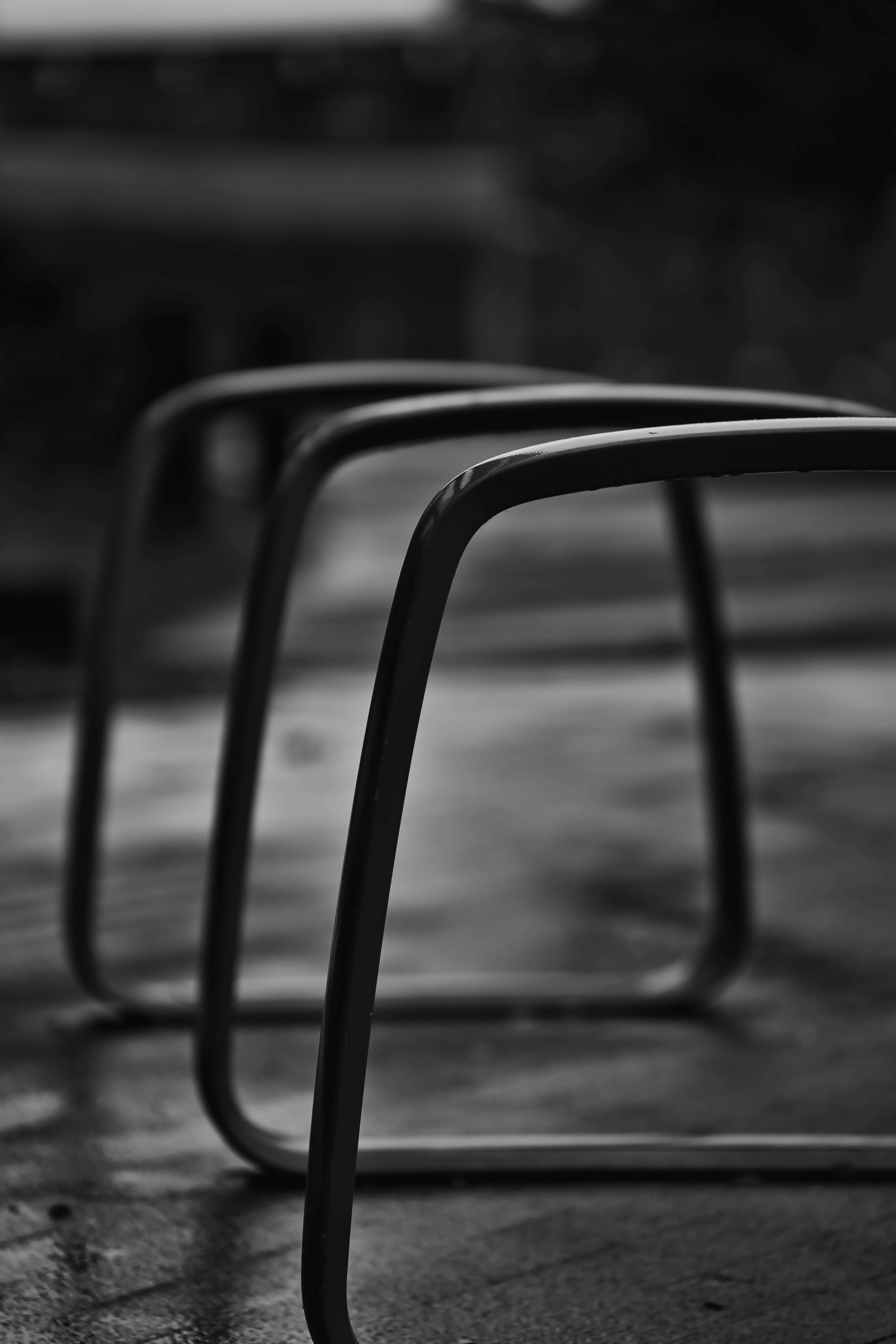 Parallel Arcs: A Monochrome Portrait of Weathered Steel Racks